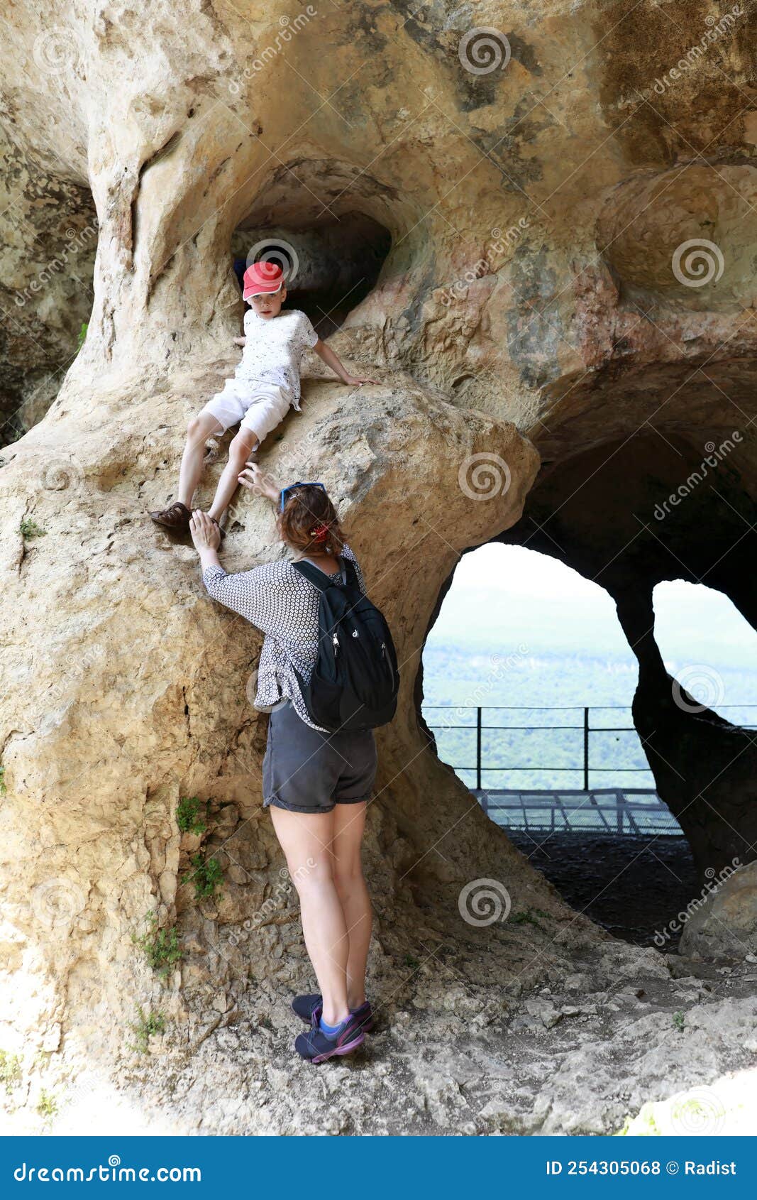 Mother Helps Her Son Descend from Cliff in Grotto on Una-Koz Ridge ... Mother Helps Her Son Descend from Cliff in Grotto on Una-Koz Ridge ...