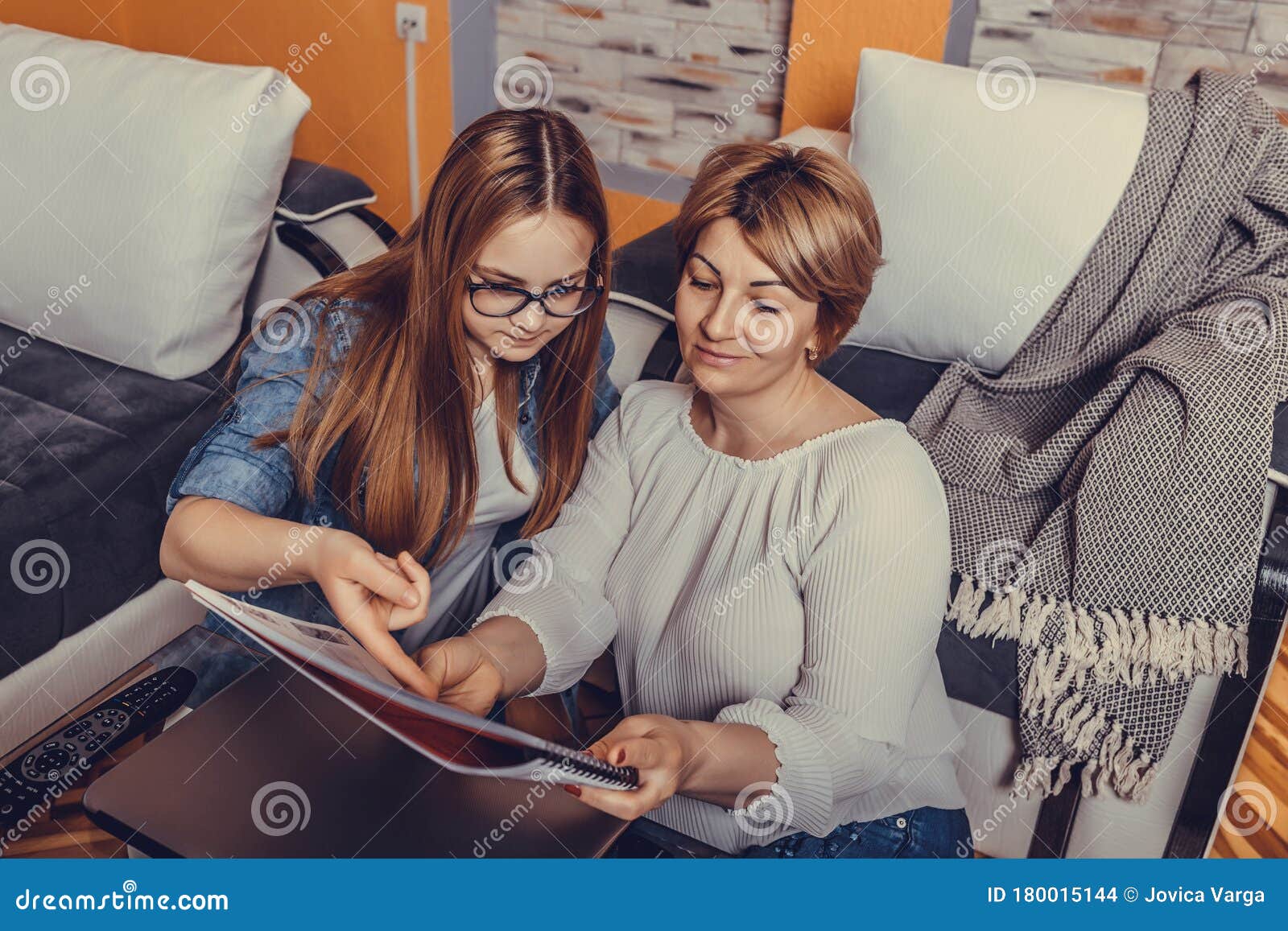 Mother Helps Her Teenage Daughter with Homework, Learning and Reading ... Mother Helps Her Teenage Daughter with Homework, Learning and Reading ...
