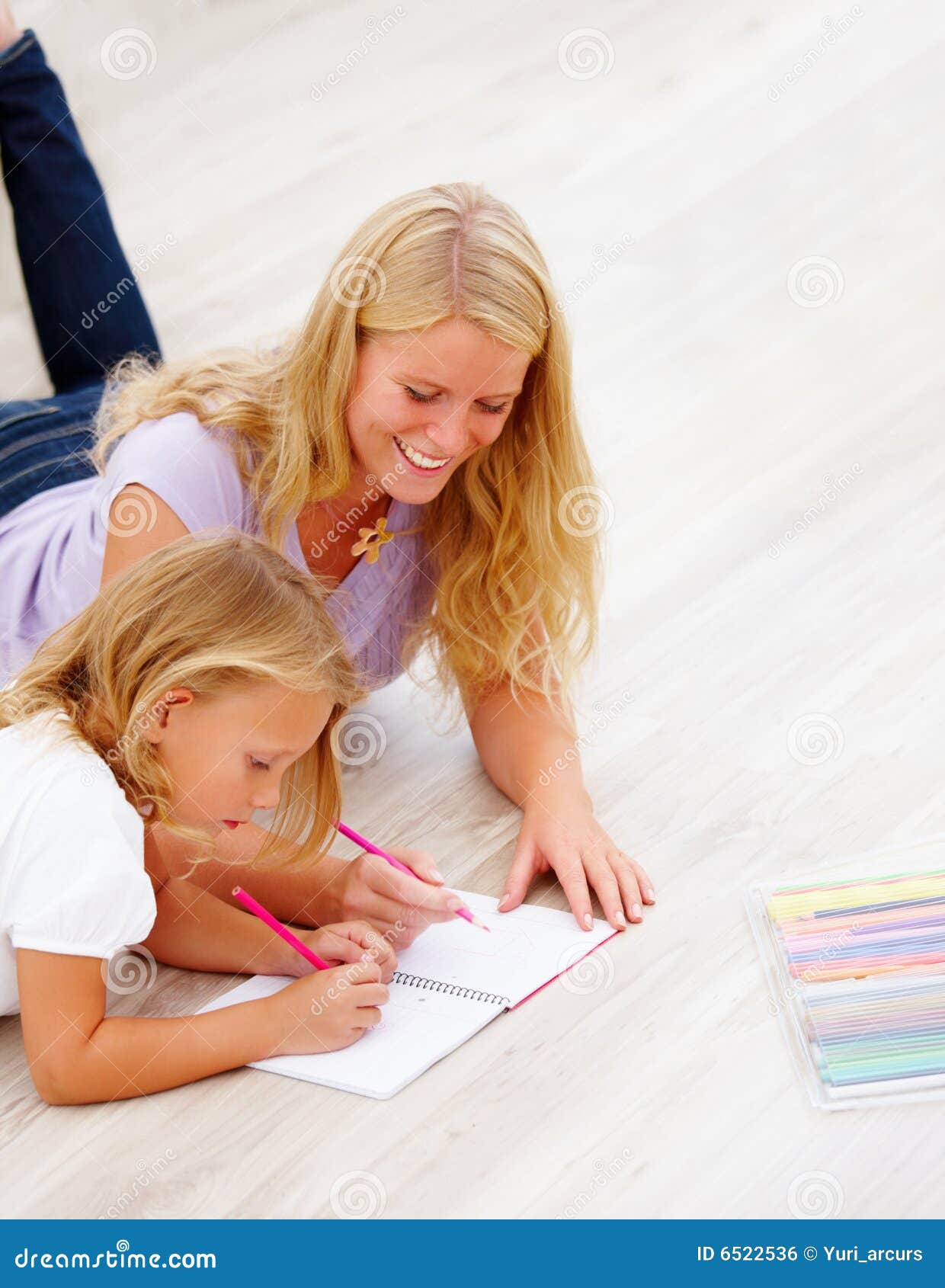 Mother with Her Daughter Lying on the Floor Stock Photo - Image of ...