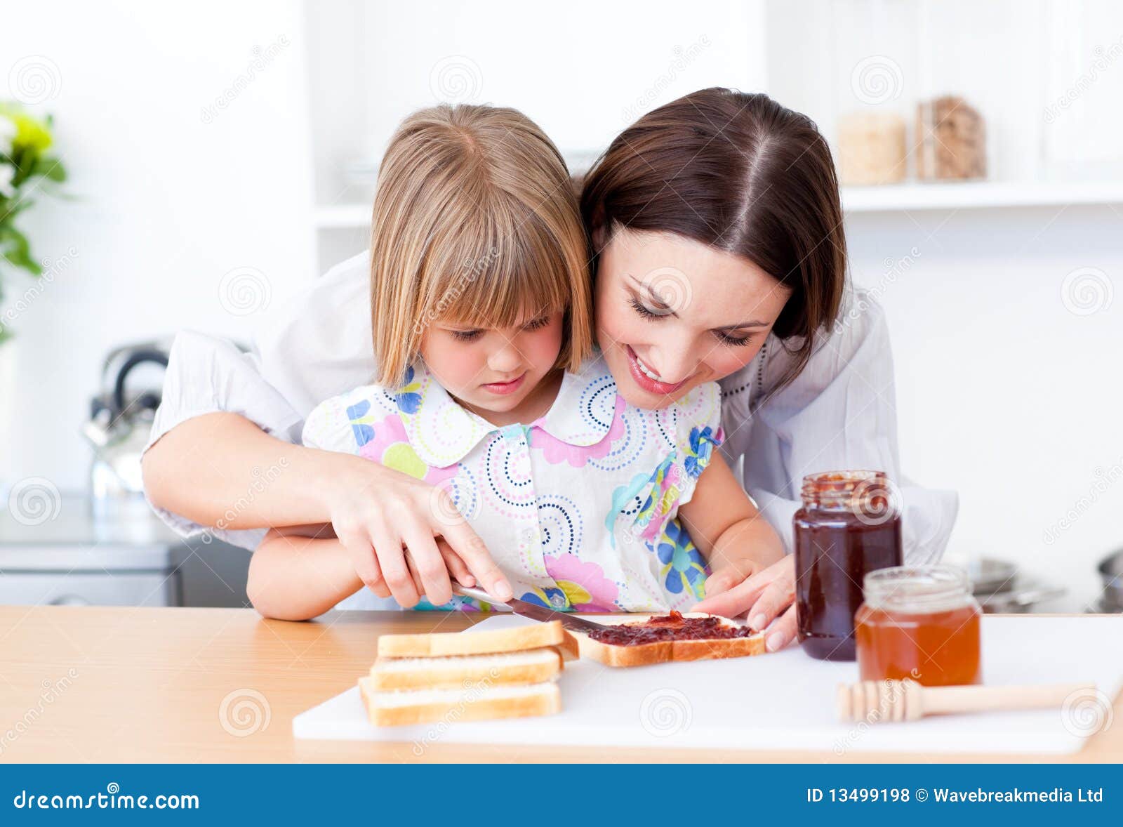 Mother and Her Daughter Preparing a Breakfast Stock Photo - Image of ...