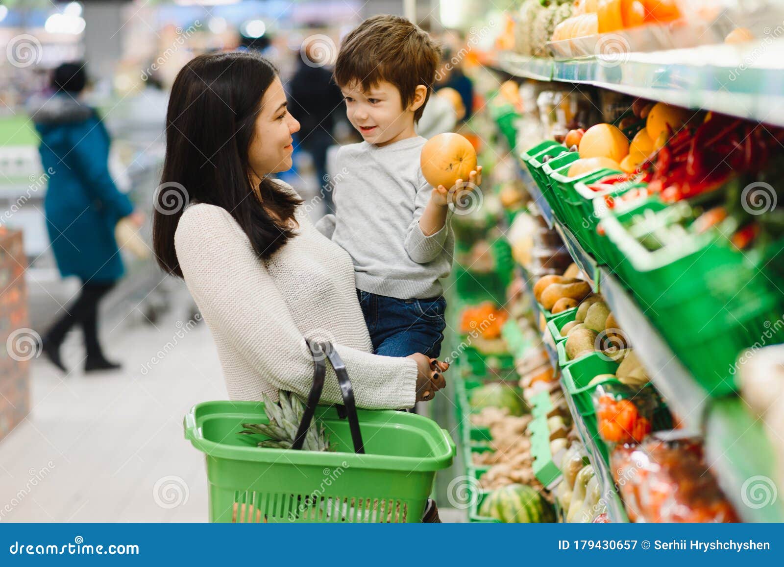 Mother And Her Son Buying Fruits At A Farmers Market Stock Image