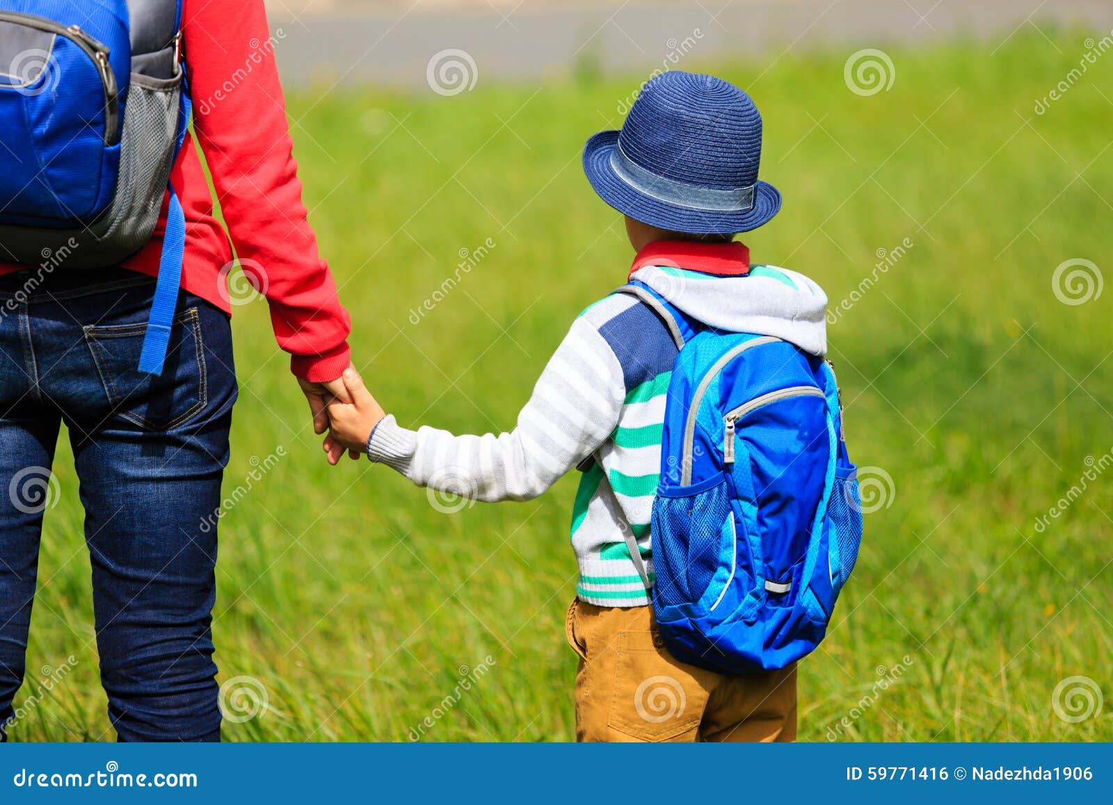 Mother Holding Hand of Little Son with Backpack Stock Photo - Image of ...