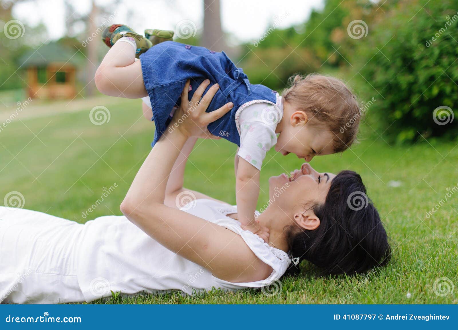 Mother Holding Laughing Child Stock Image - Image of outdoors, daughter ...