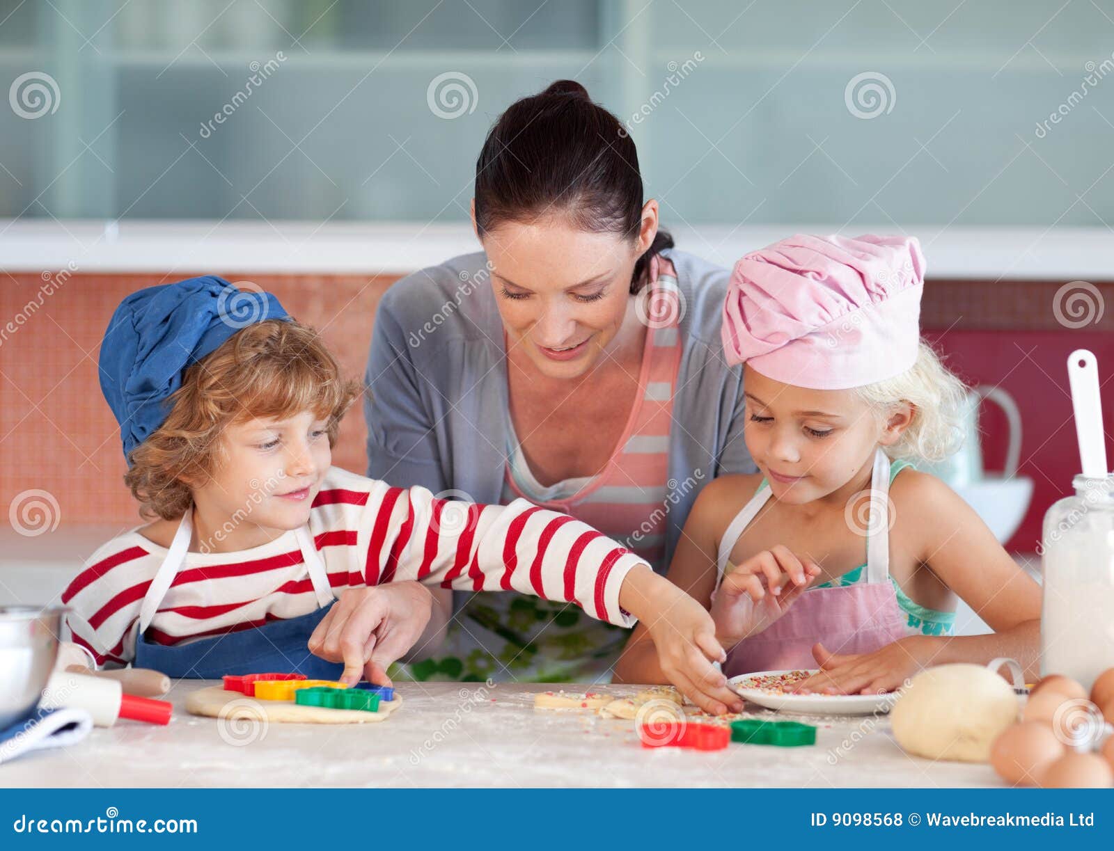 Mother Interacting with Children in Kitchen Stock Photo - Image of hand ...