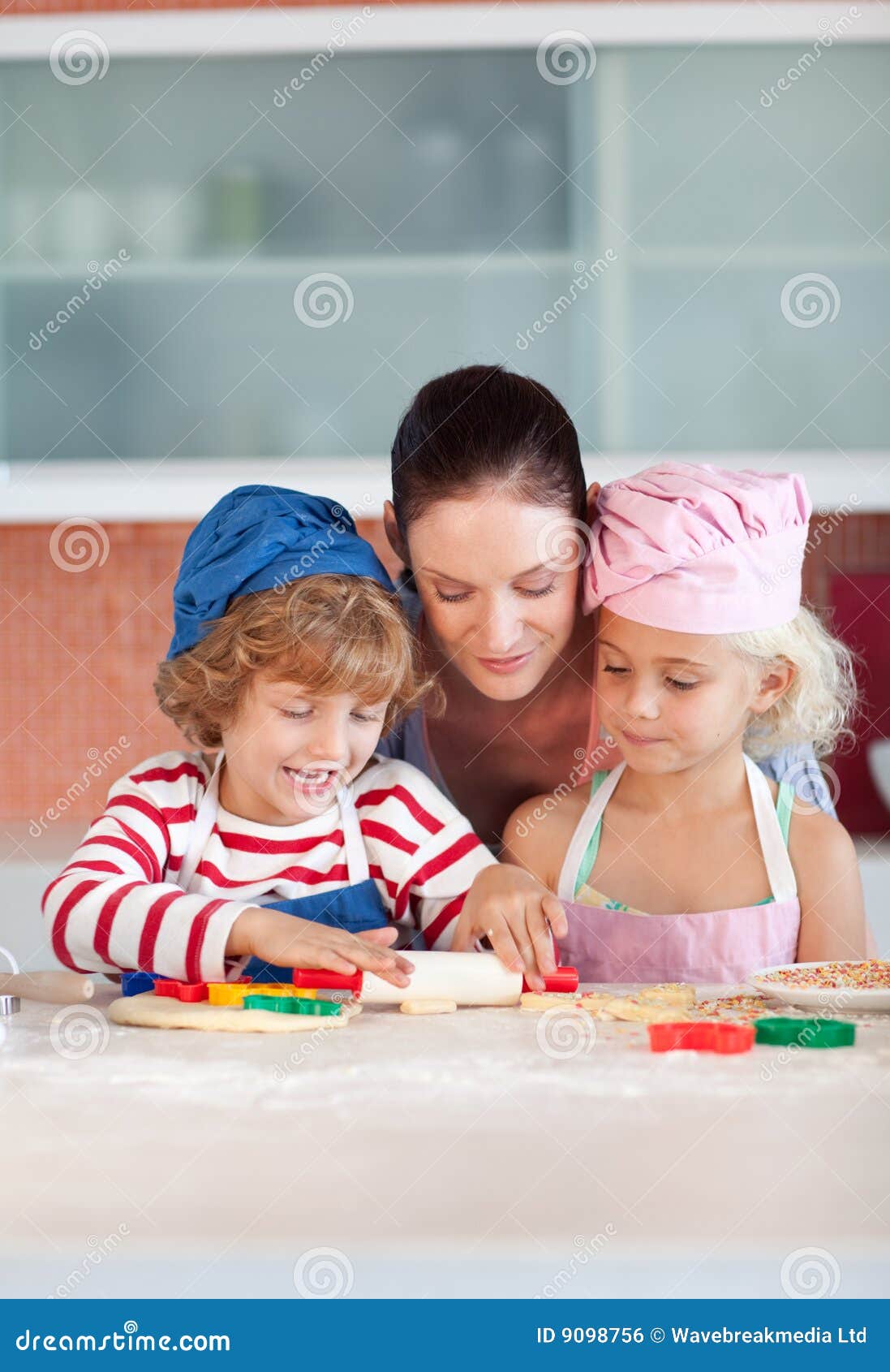 Mother Interacting with Children in Kitchen Stock Photo - Image of copy ...
