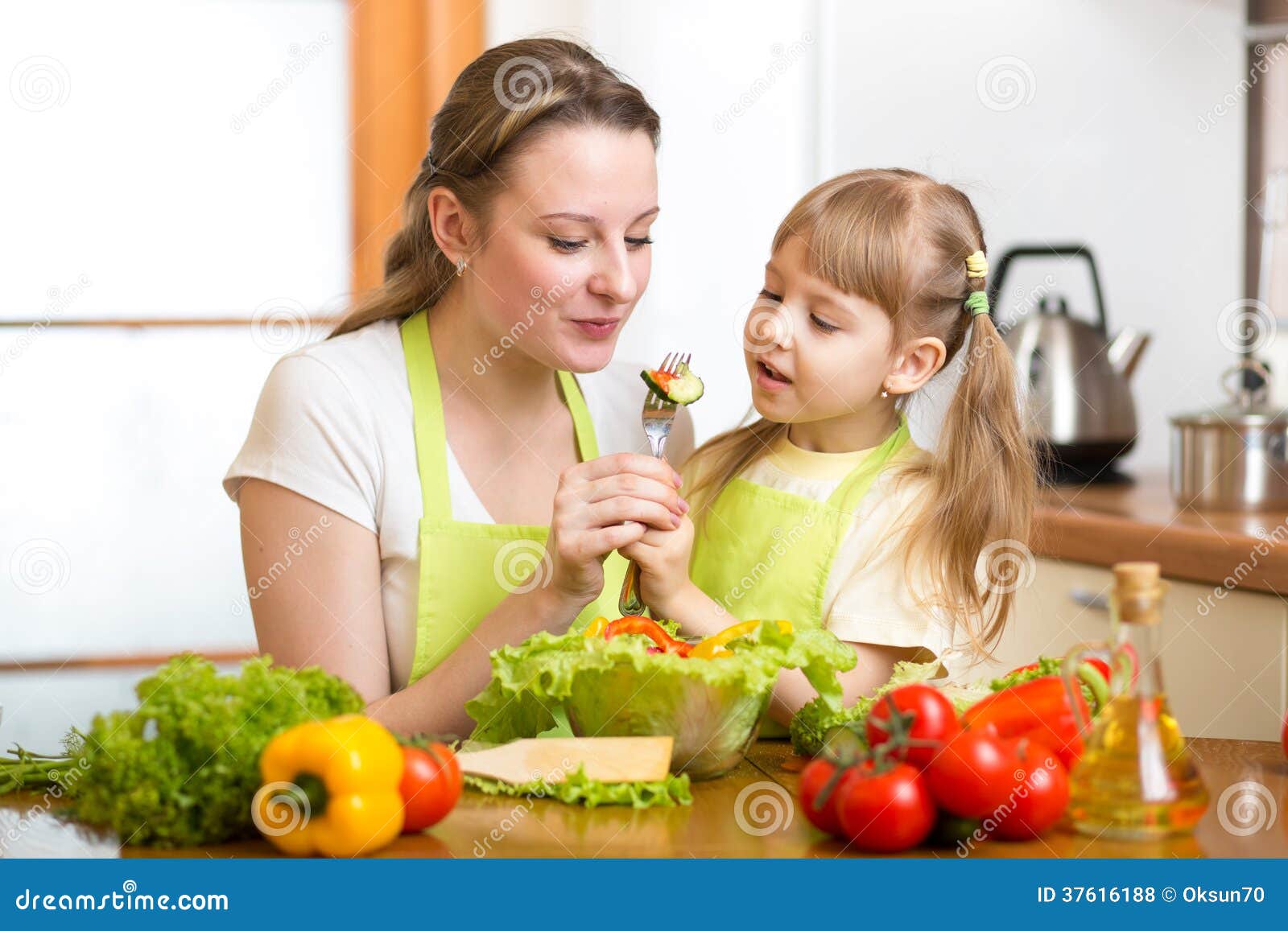 Mother with Kid Cooking and Tasting of Food Stock Photo - Image of ...