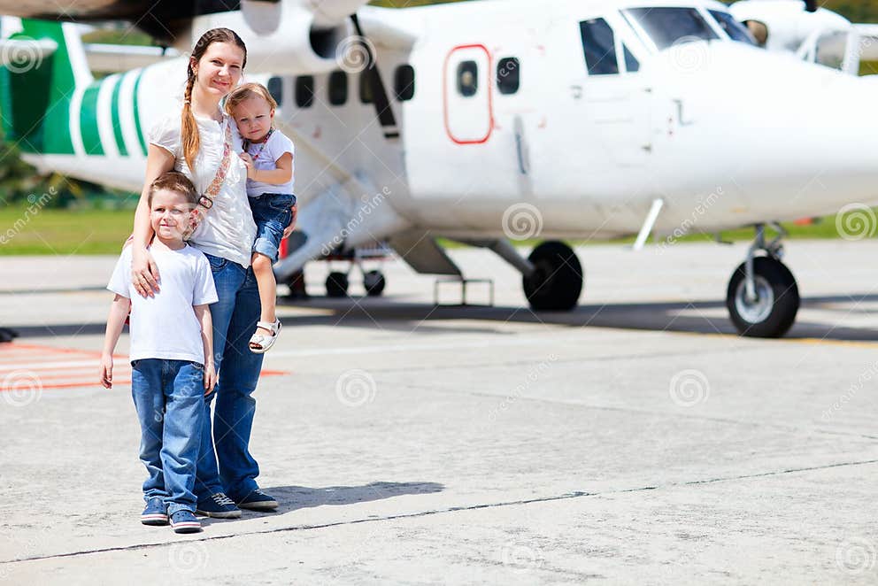 Mother and Kids in Front of Airplane Stock Photo - Image of journey ...