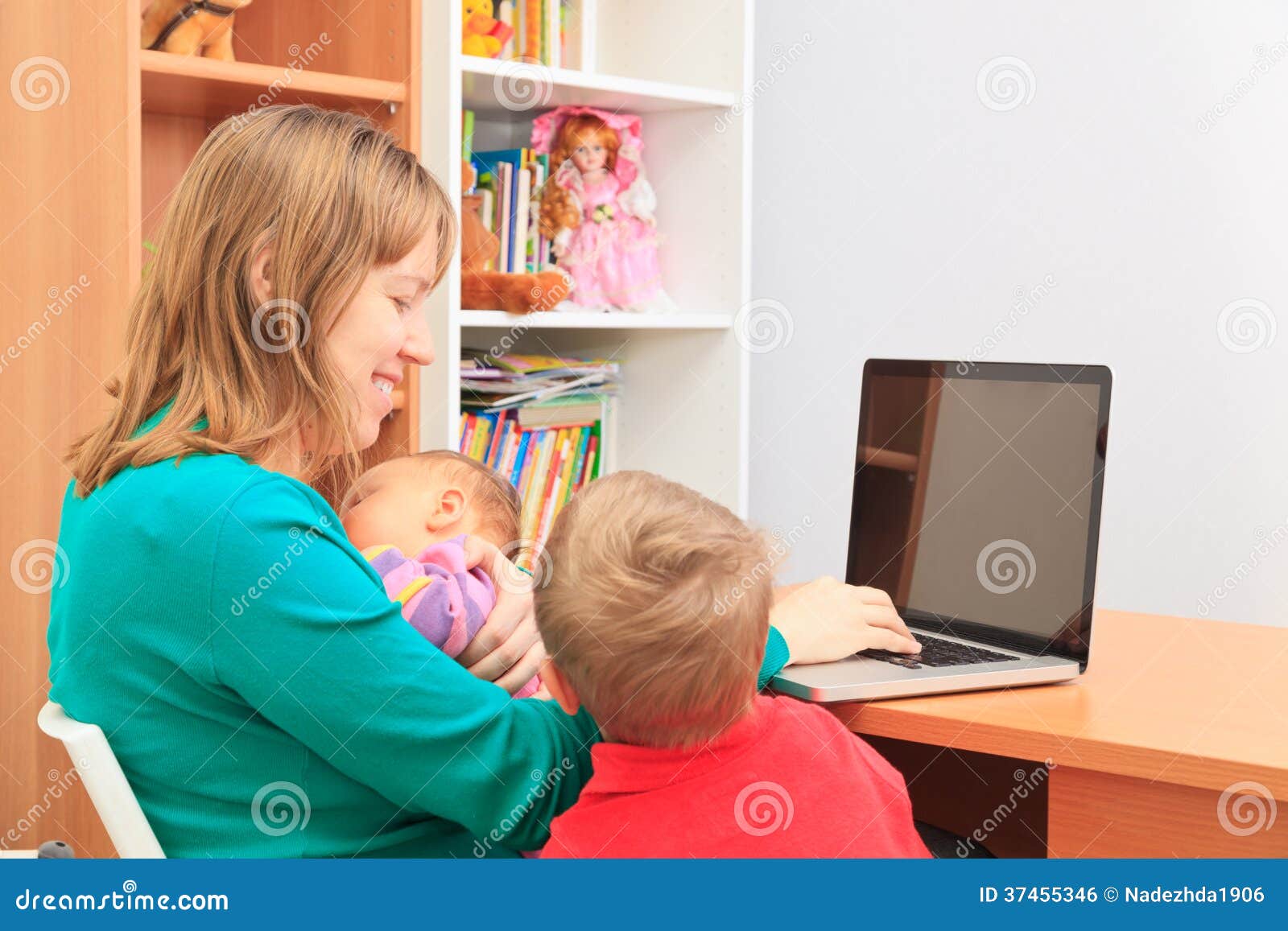 Mother with Kids Working on Laptop at Home Stock Photo - Image of ...