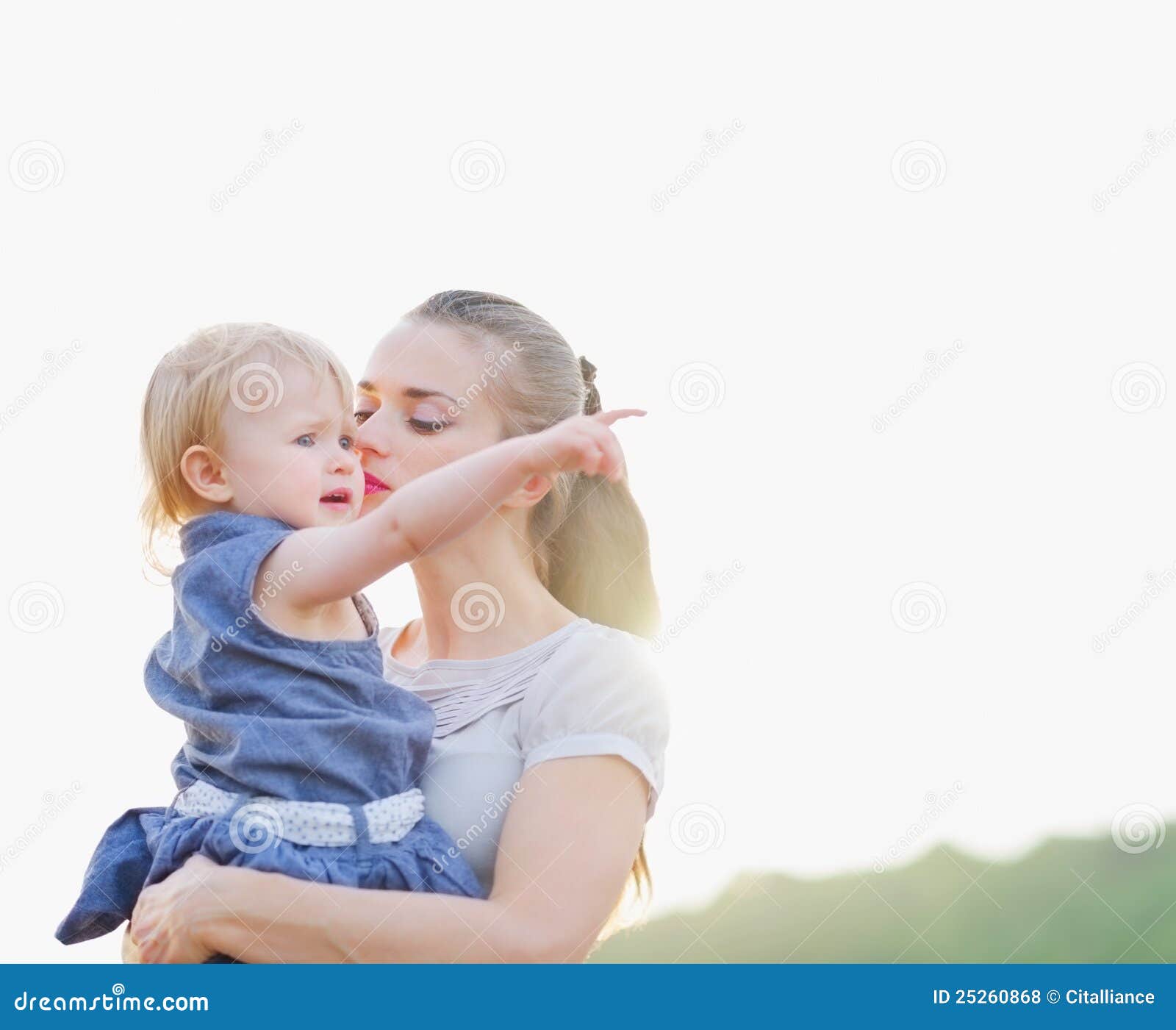Mother Kissing Baby Pointing on Copy Space Stock Photo - Image of ...