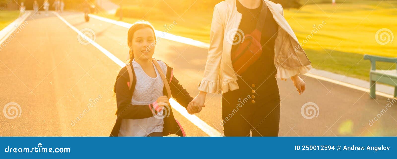 Mother and Little Daughter Go To School. Woman Looks at Her Watch ... Mother and Little Daughter Go To School. Woman Looks at Her Watch ...