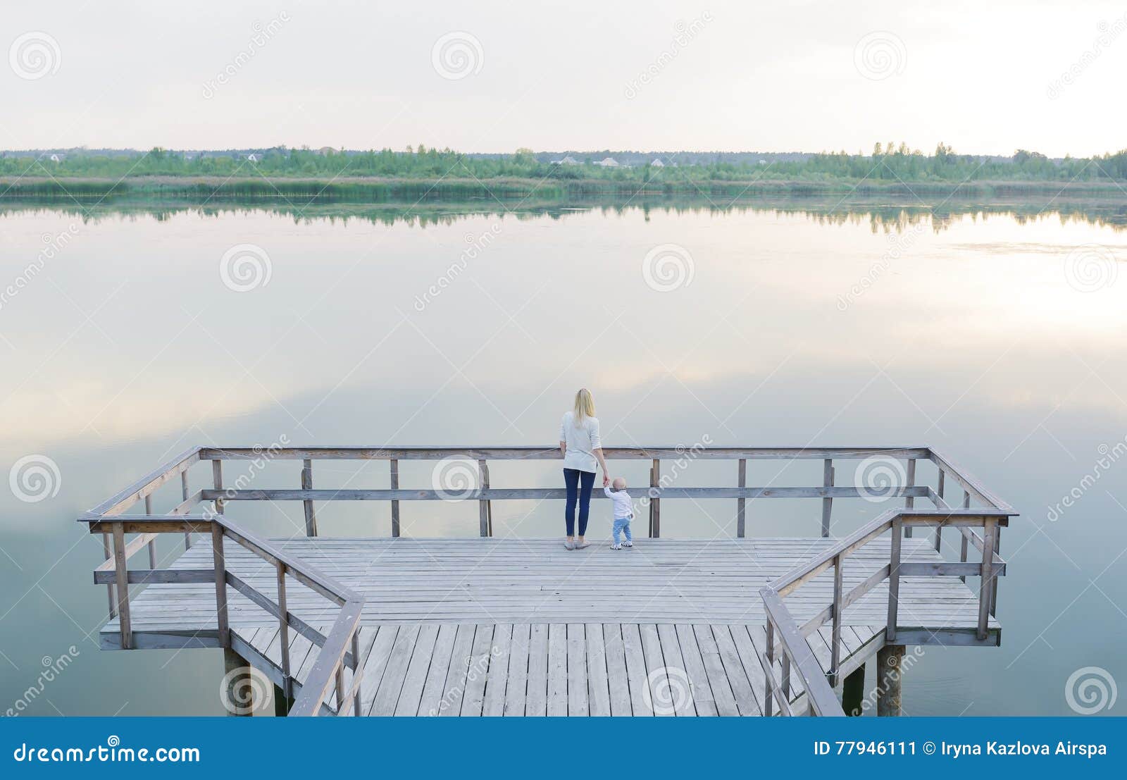 Mother and the Little Daughter are on the River Jetty. Sunset Stock ...