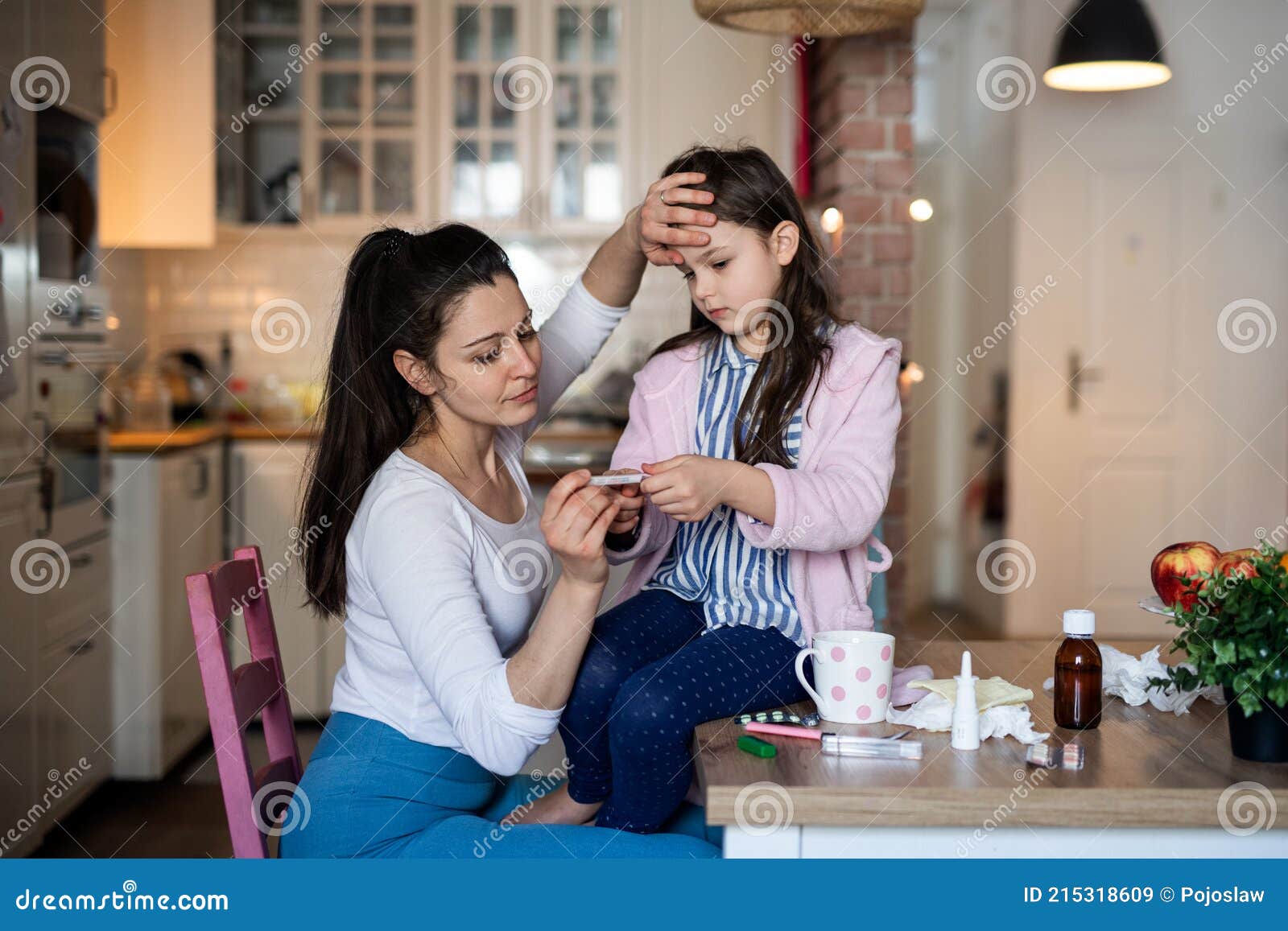 Mother Looking after Sick Small Daughter at Home. Stock Image - Image ...