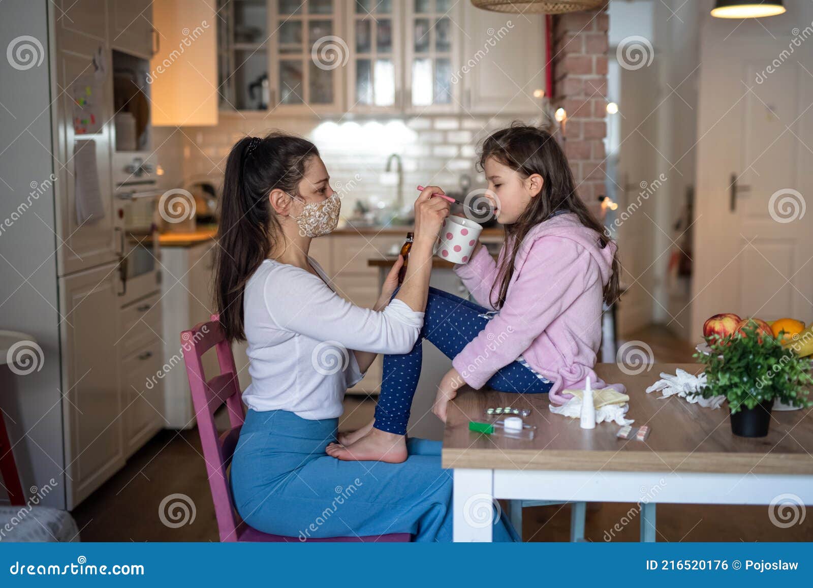 Mother Looking after Sick Small Daughter at Home. Stock Photo - Image ...
