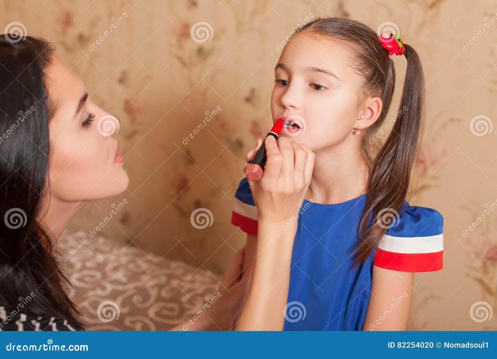 Mother Makes Up Lips of Her Little Daughter Stock Photo - Image of ...