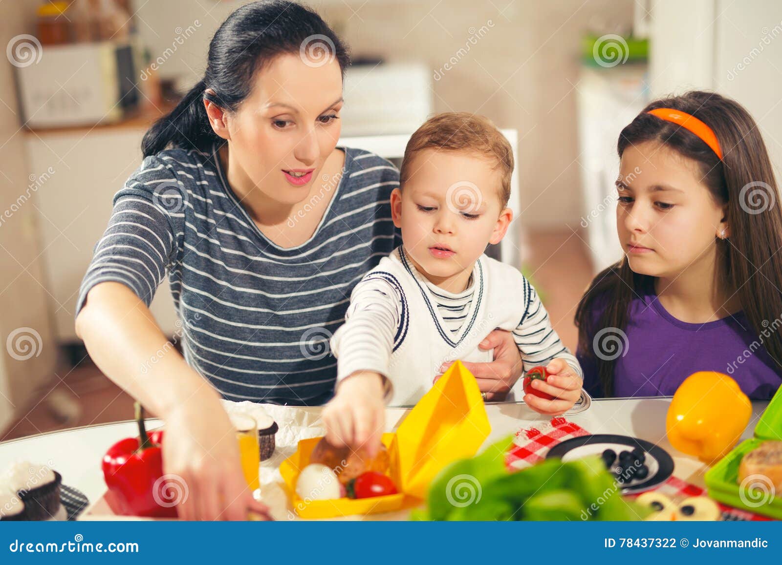 Mother Making Breakfast for Her Children Stock Photo - Image of ...
