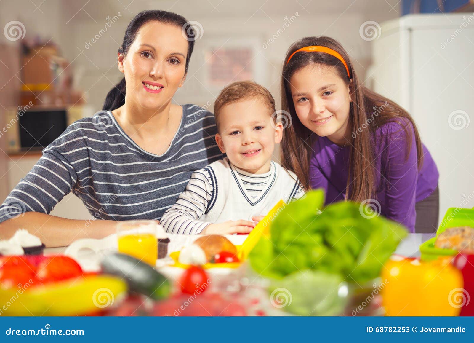 Mother Making Breakfast for Her Children in the Morning at Home Stock ...
