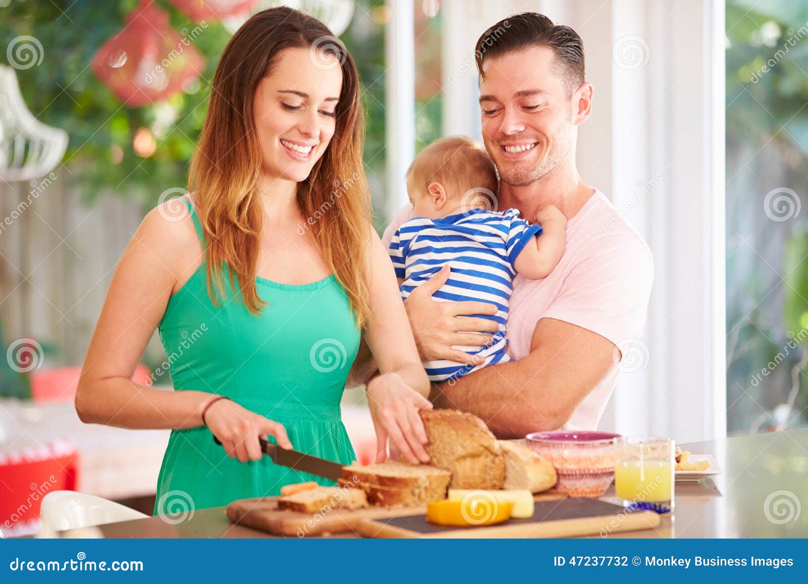 Mother Making Snack for Family in Kitchen Stock Photo - Image of family ...