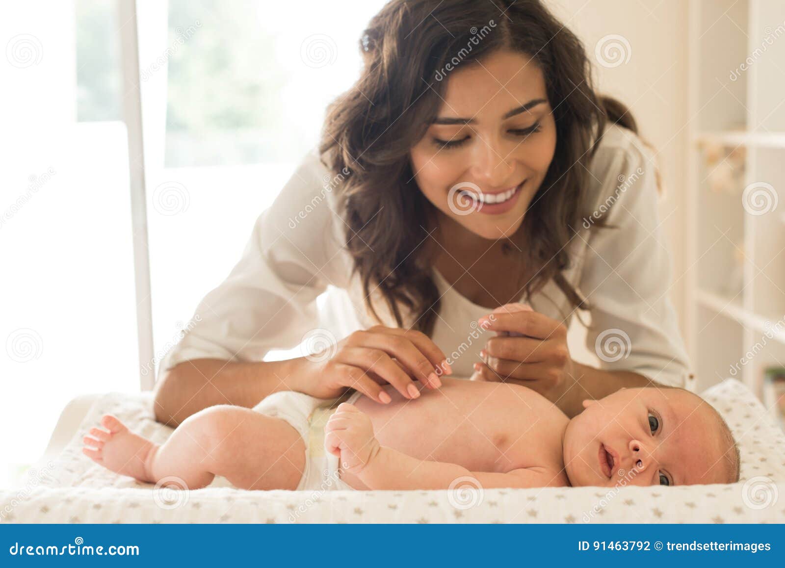 Mother moisturizing baby stock photo. Image of moist - 91463792