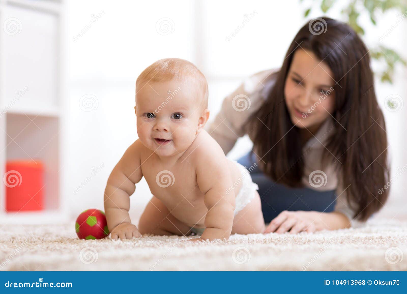 Mother Playing with Creeping on Floor Baby Stock Photo - Image of ...