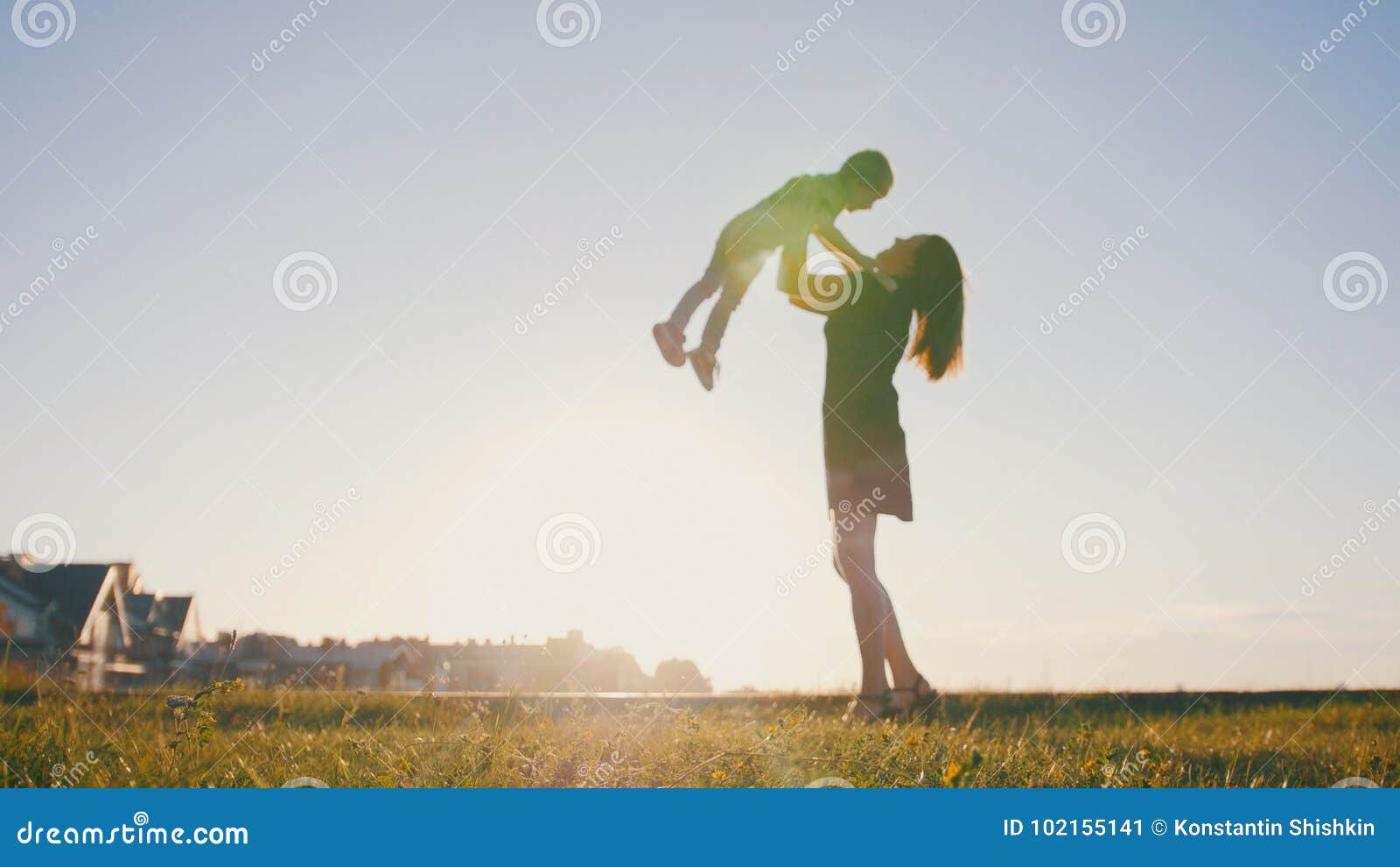 Mother Playing with Little Child at Sunset - Throws the Son Stock Image ...