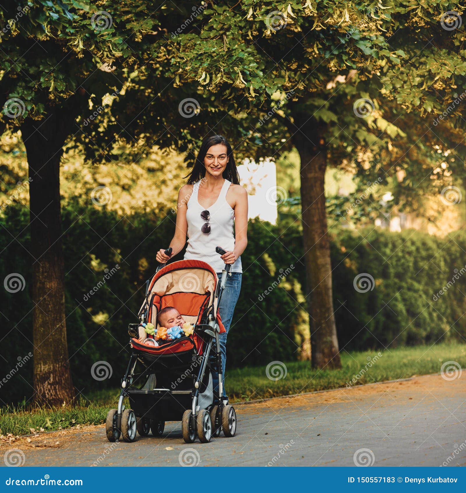 Mother with pram in park stock image. Image of parenthood - 150557183