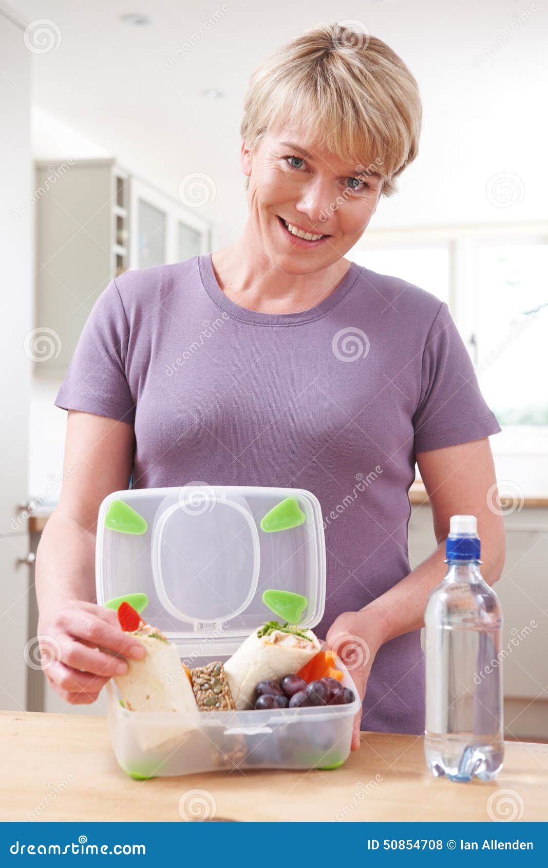 Mother Preparing Healthy Lunchbox in Kitchen Stock Photo - Image of ...