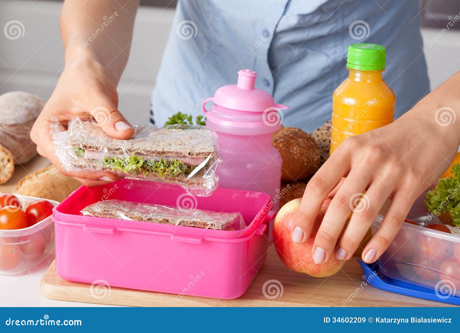 Mother preparing lunch box stock image. Image of fruit - 34602209