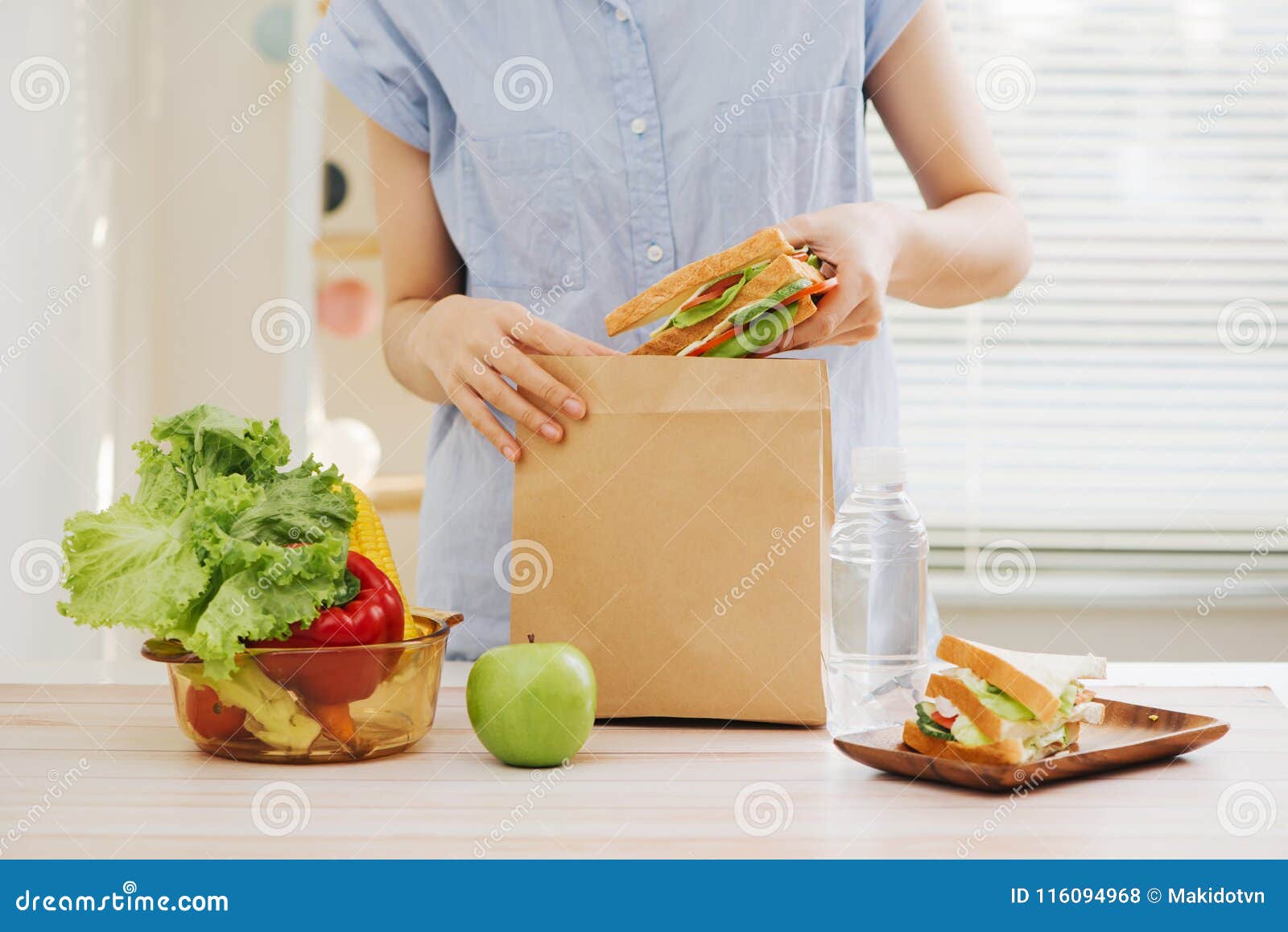 Mother Preparing Sandwich for School Lunch on Table Stock Photo - Image ...