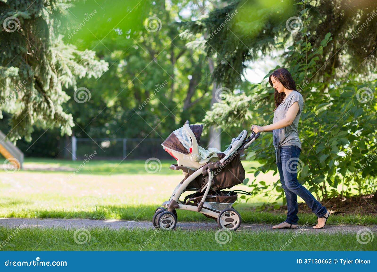 Mother Pushing Stroller in the Park Stock Photo - Image of carriage ...