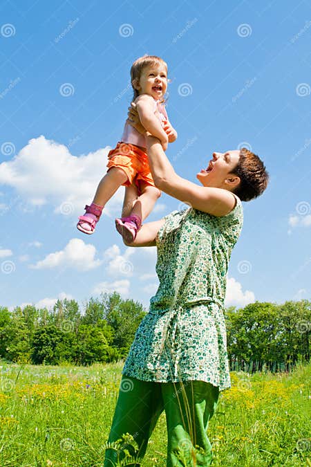 Mother raising baby stock image. Image of life, leisure - 9764231