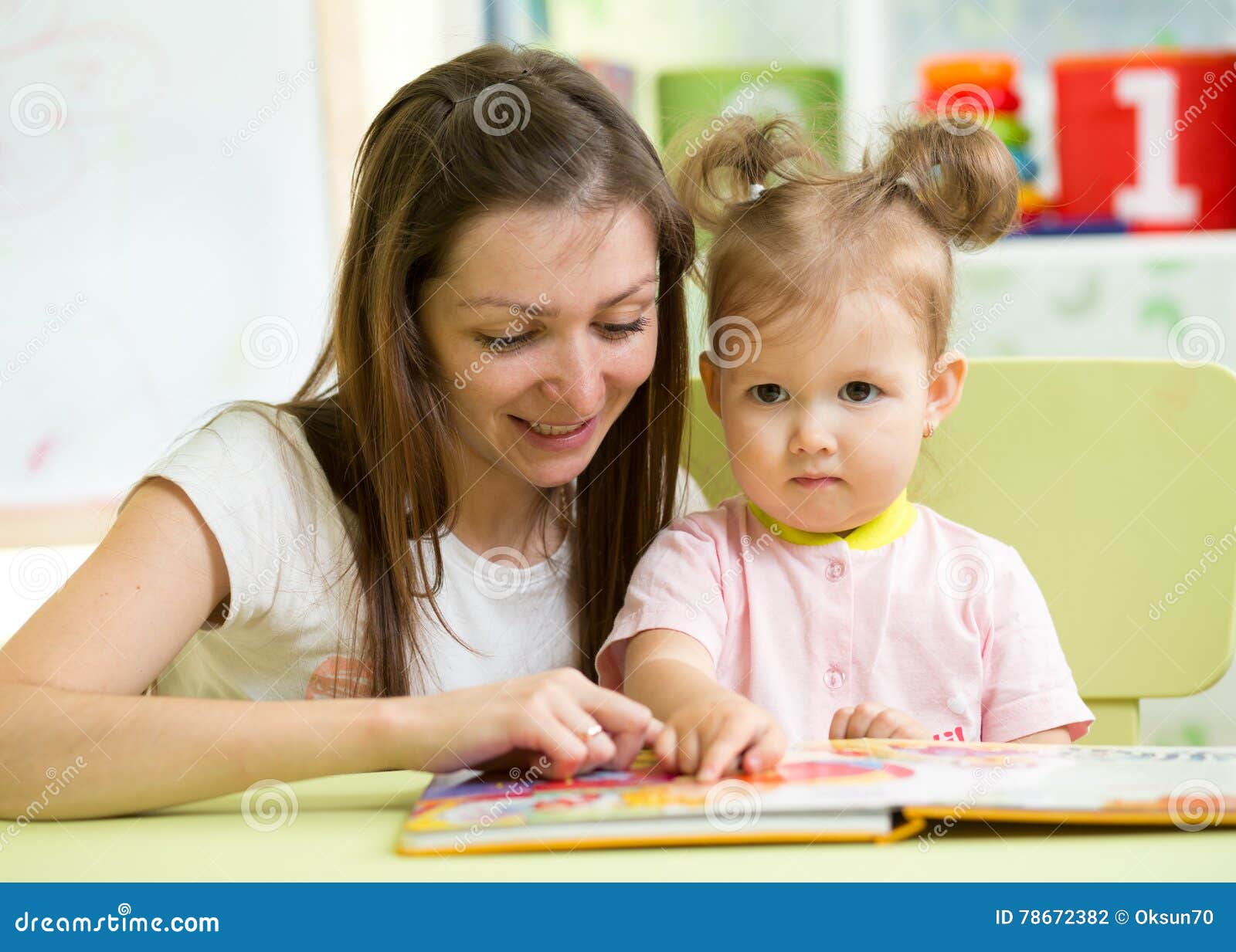 Mother Reading Book Her Kid Daughter at Table Stock Photo - Image of ...
