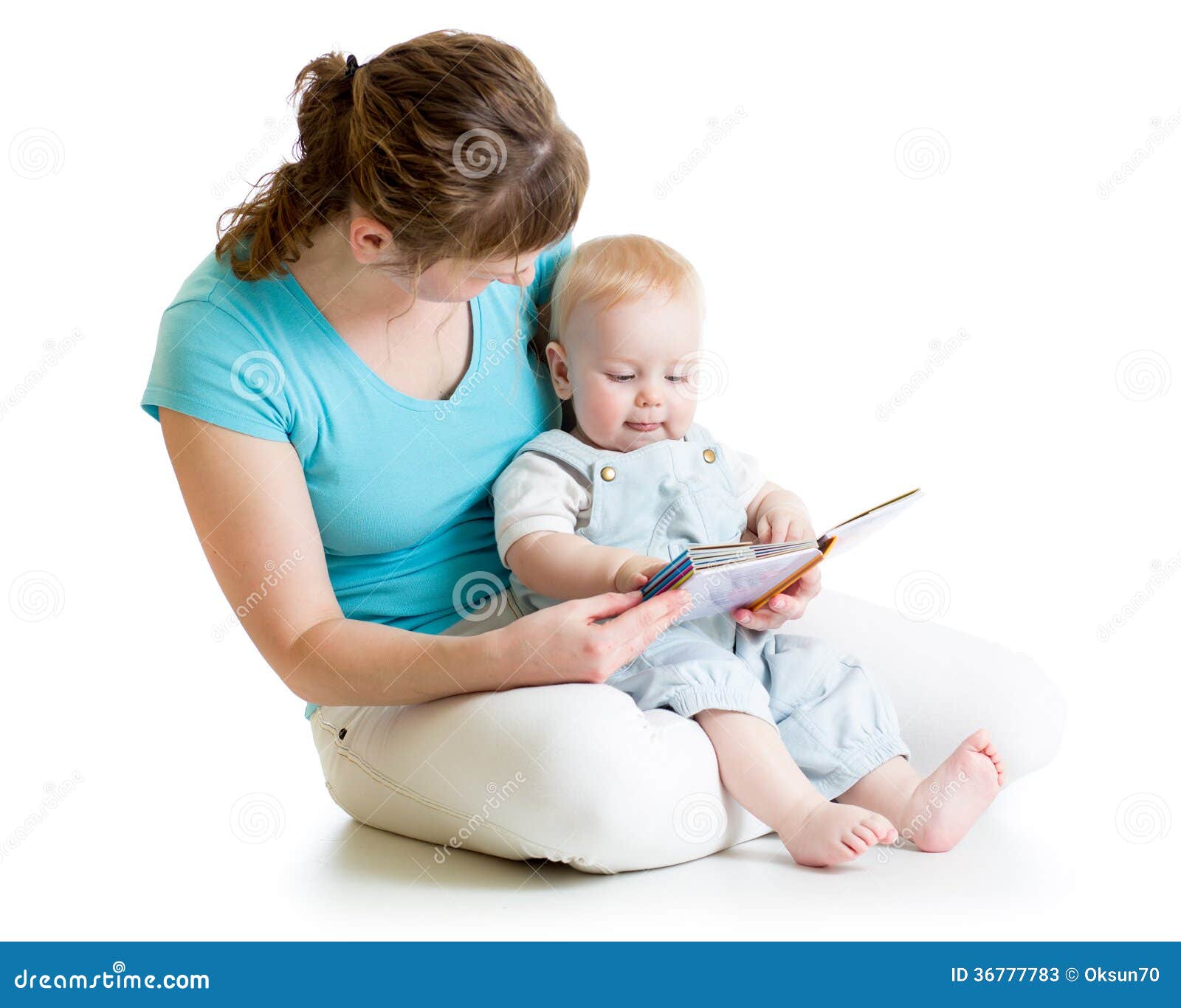 Mother Reading a Book To Her Baby Stock Image - Image of interested ...