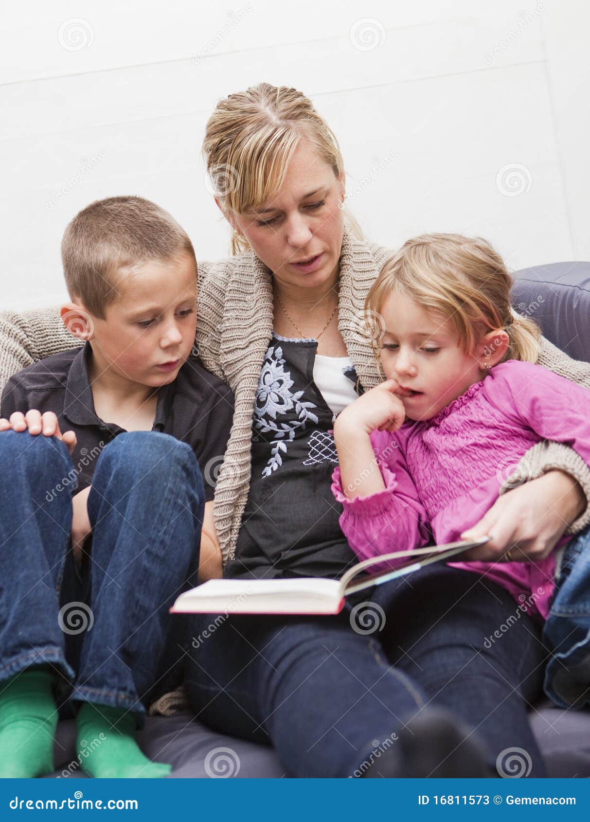 Mother Reading a Book To Her Children Stock Image - Image of organized ...