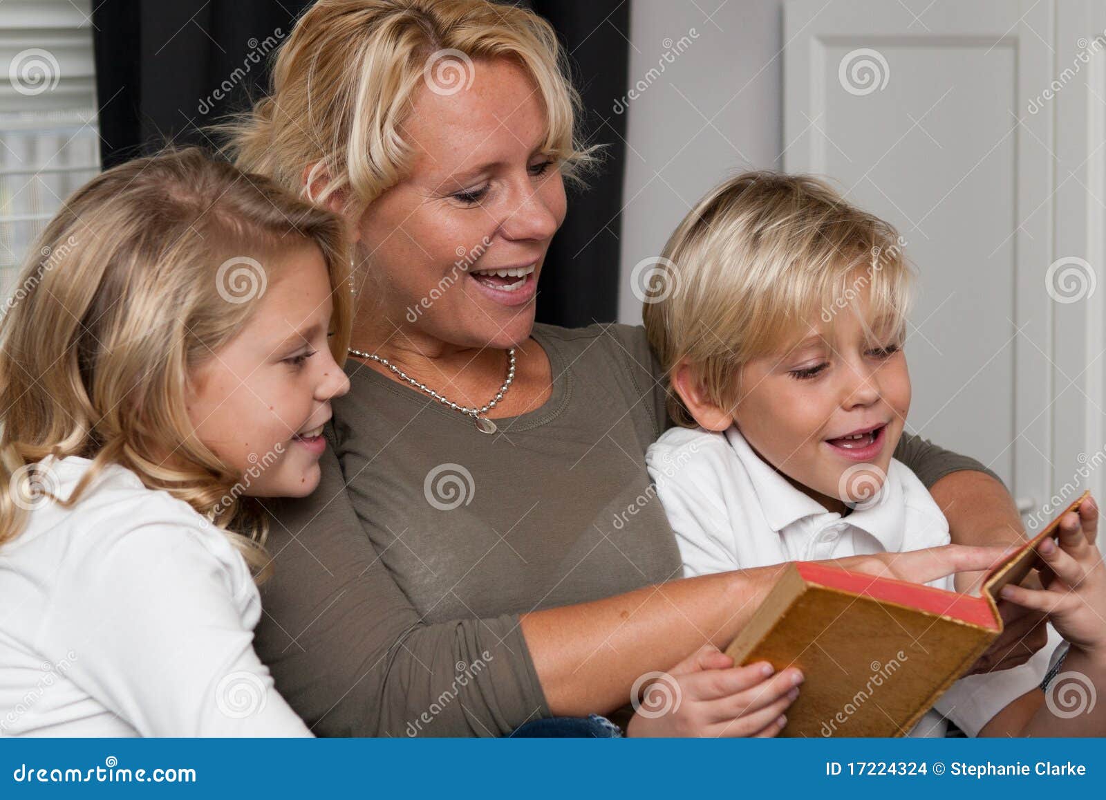 Mother reading to children stock photo. Image of face - 17224324