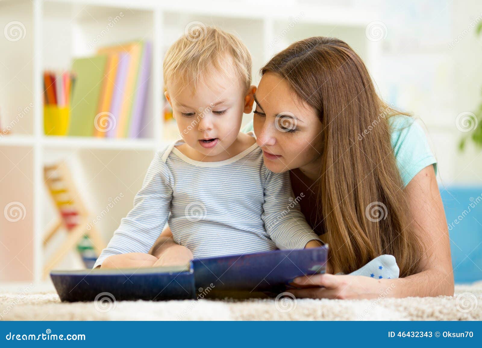 Mother Reads a Book To Kid at Home Stock Image - Image of child ...