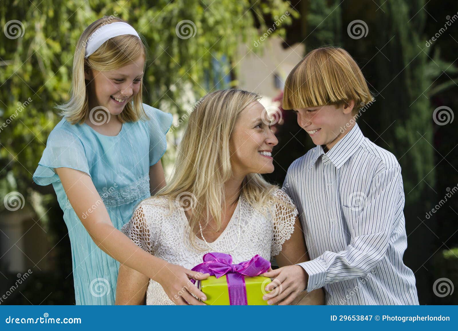 Mother Receiving Gift from Kids Stock Image - Image of holding, hair ...