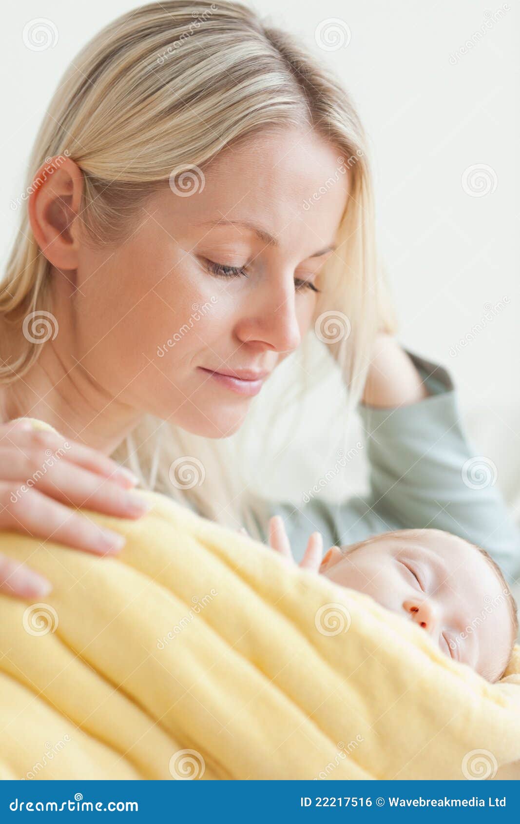 Mother Resting Next To Her Sleeping Baby Stock Photo - Image of joyful ...