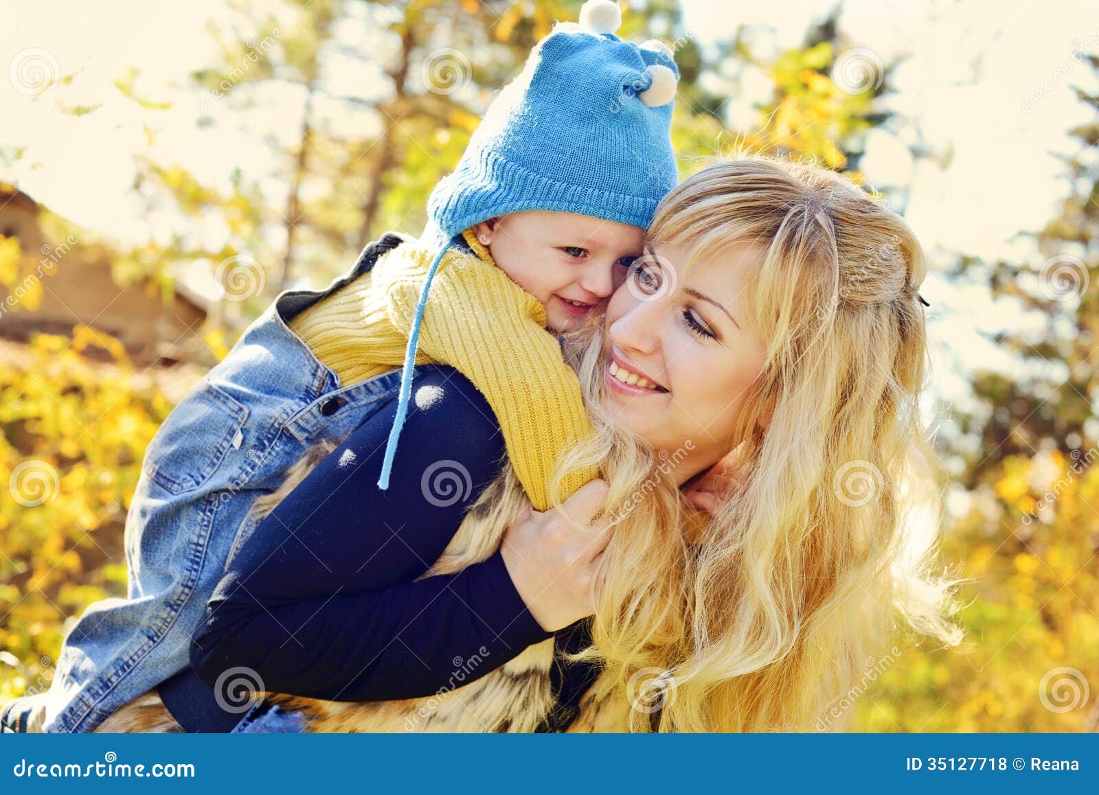 On the mother s back stock photo. Image of autumn, mother - 35127718