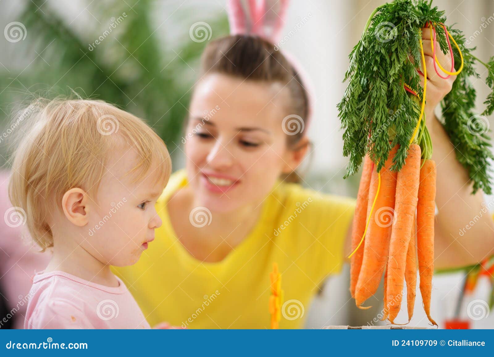 Mother Showing Baby Bunch of Carrots Stock Image - Image of infant ...