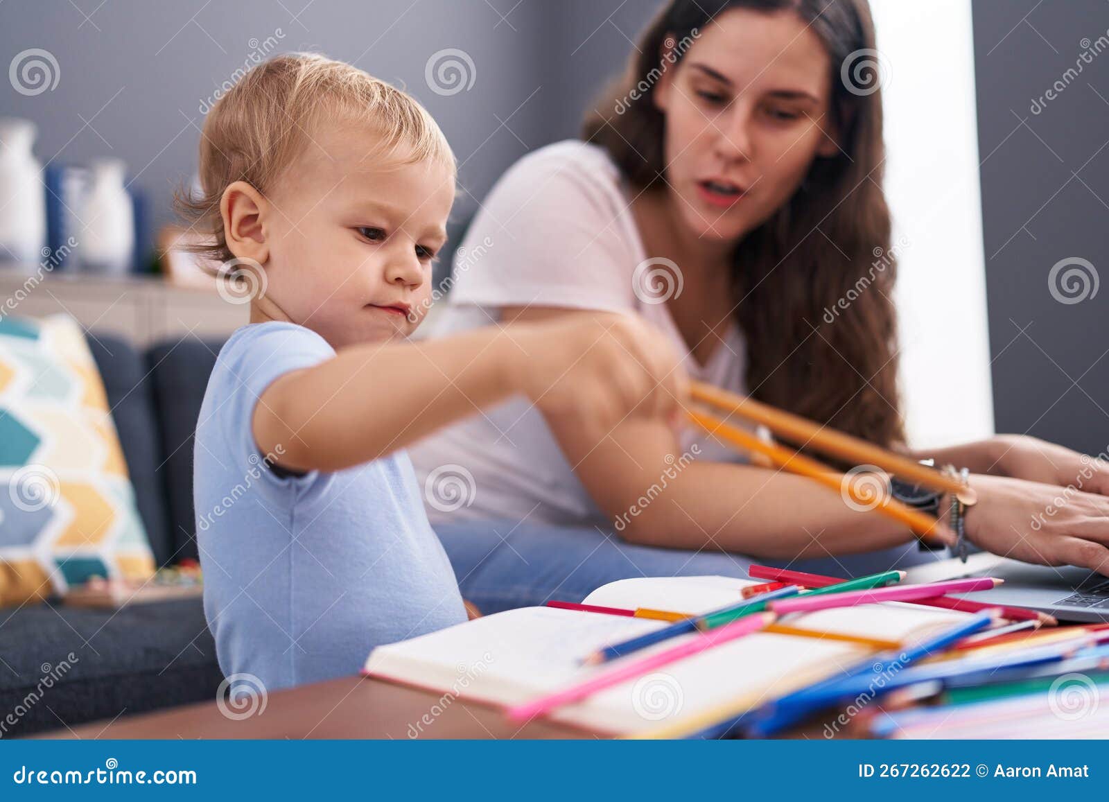 Mother and Son Drawing on Notebook Using Laptop at Home Stock Photo ...