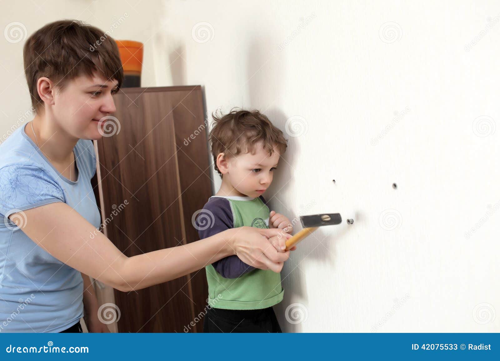 Mother and son with hammer stock image. Image of concept - 42075533