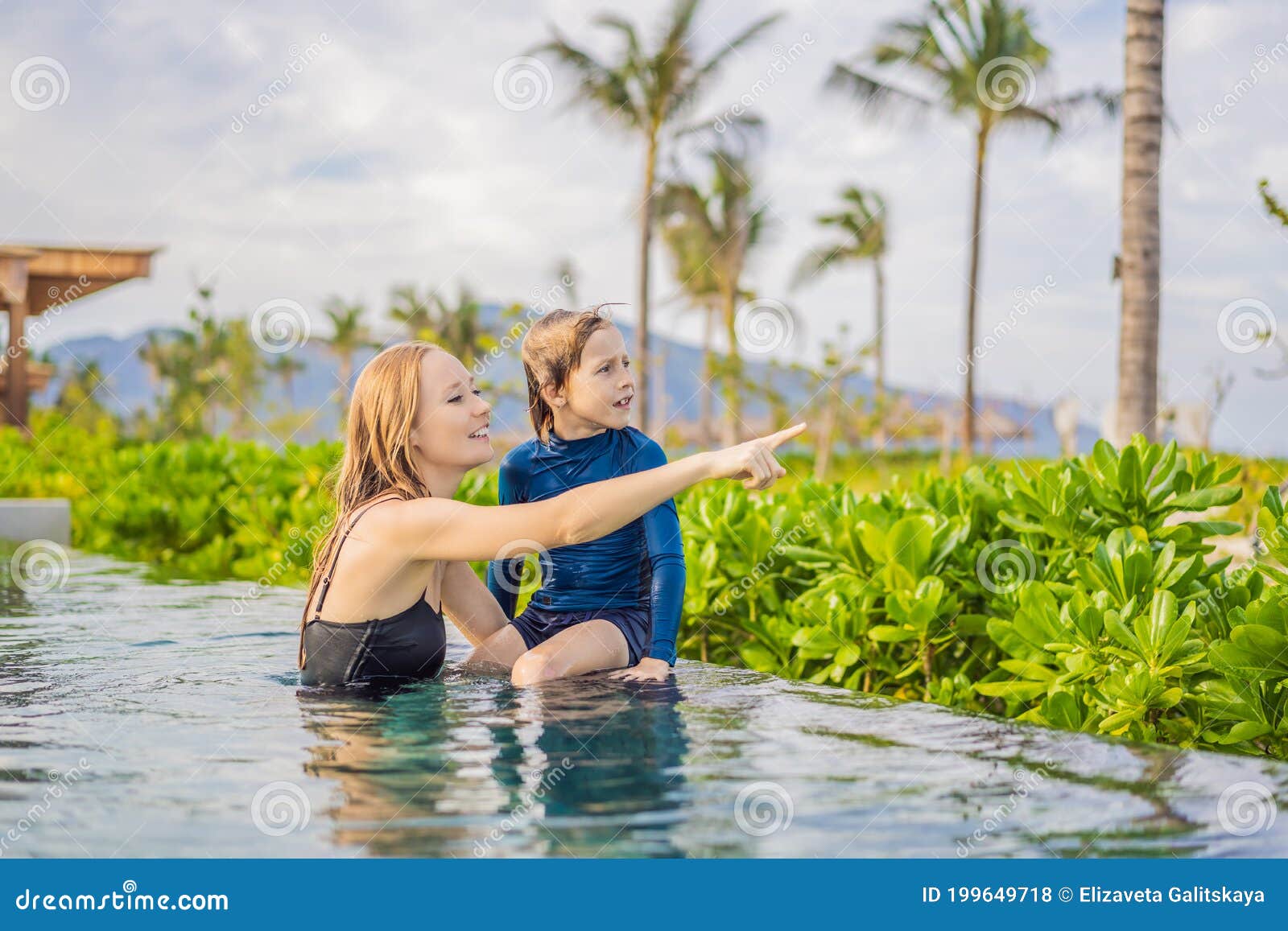 Mother and Son Having Fun in the Swimming Pool Stock Photo - Image of ...