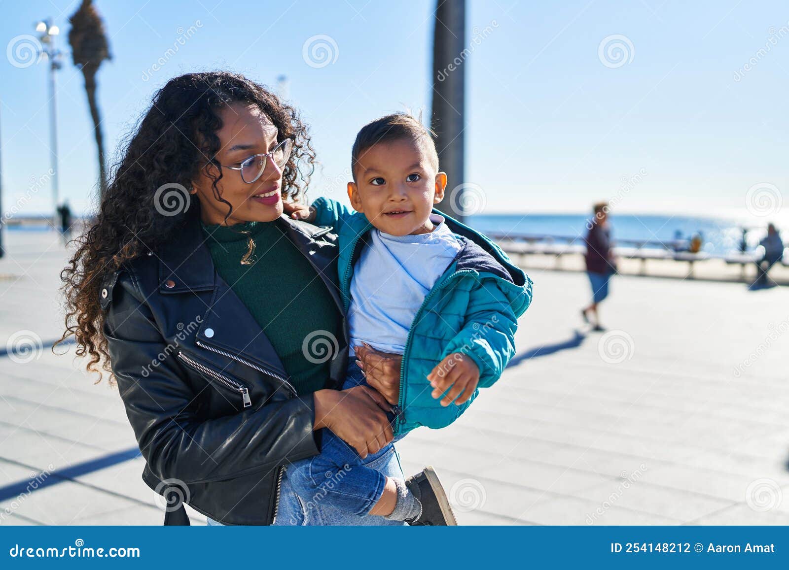 Mother and Son Hugging Each Other Standing at Seaside Stock Photo ...