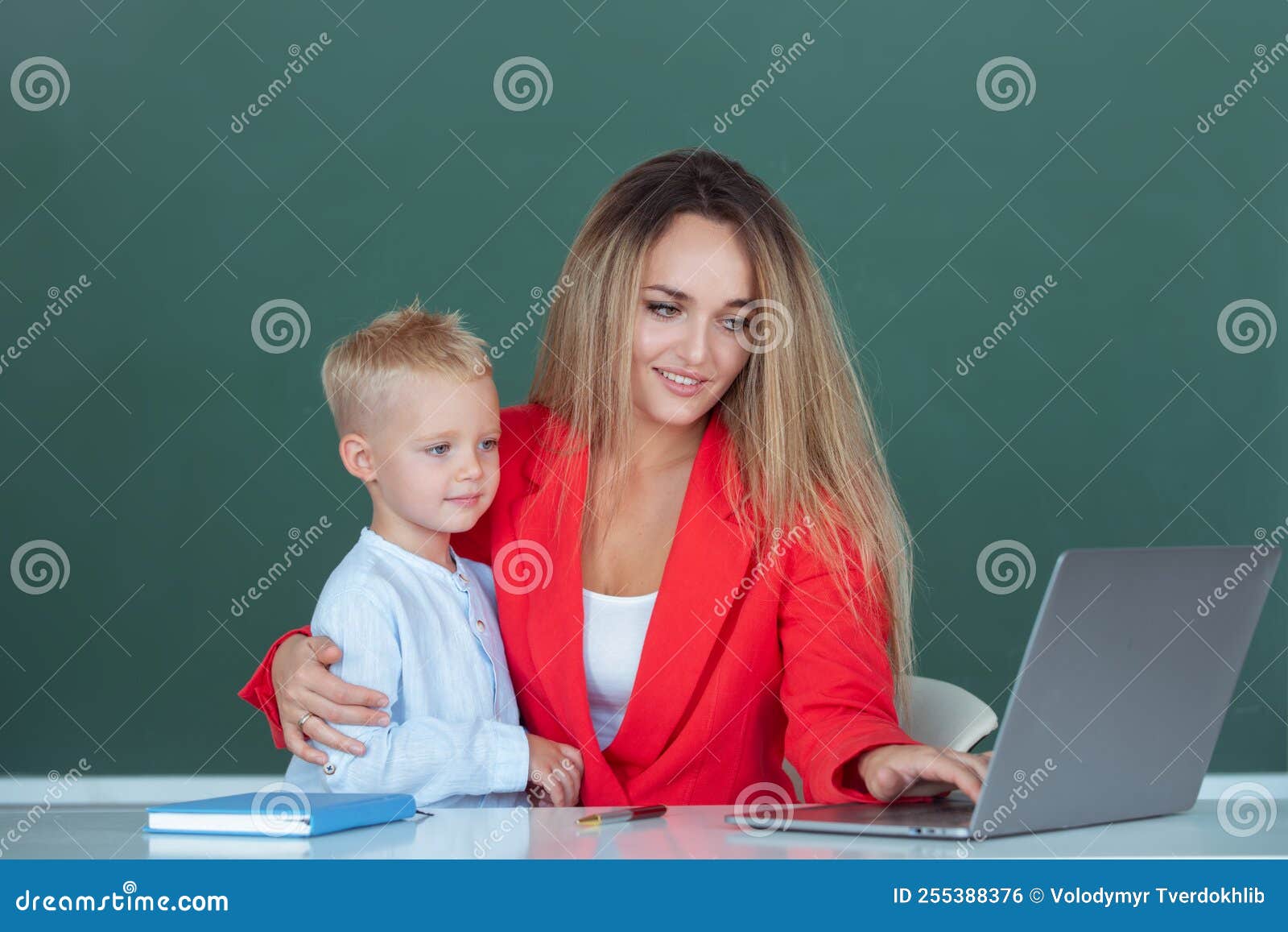 Mother and Son Learning. Teacher Helping Elementary School Pupils in ...