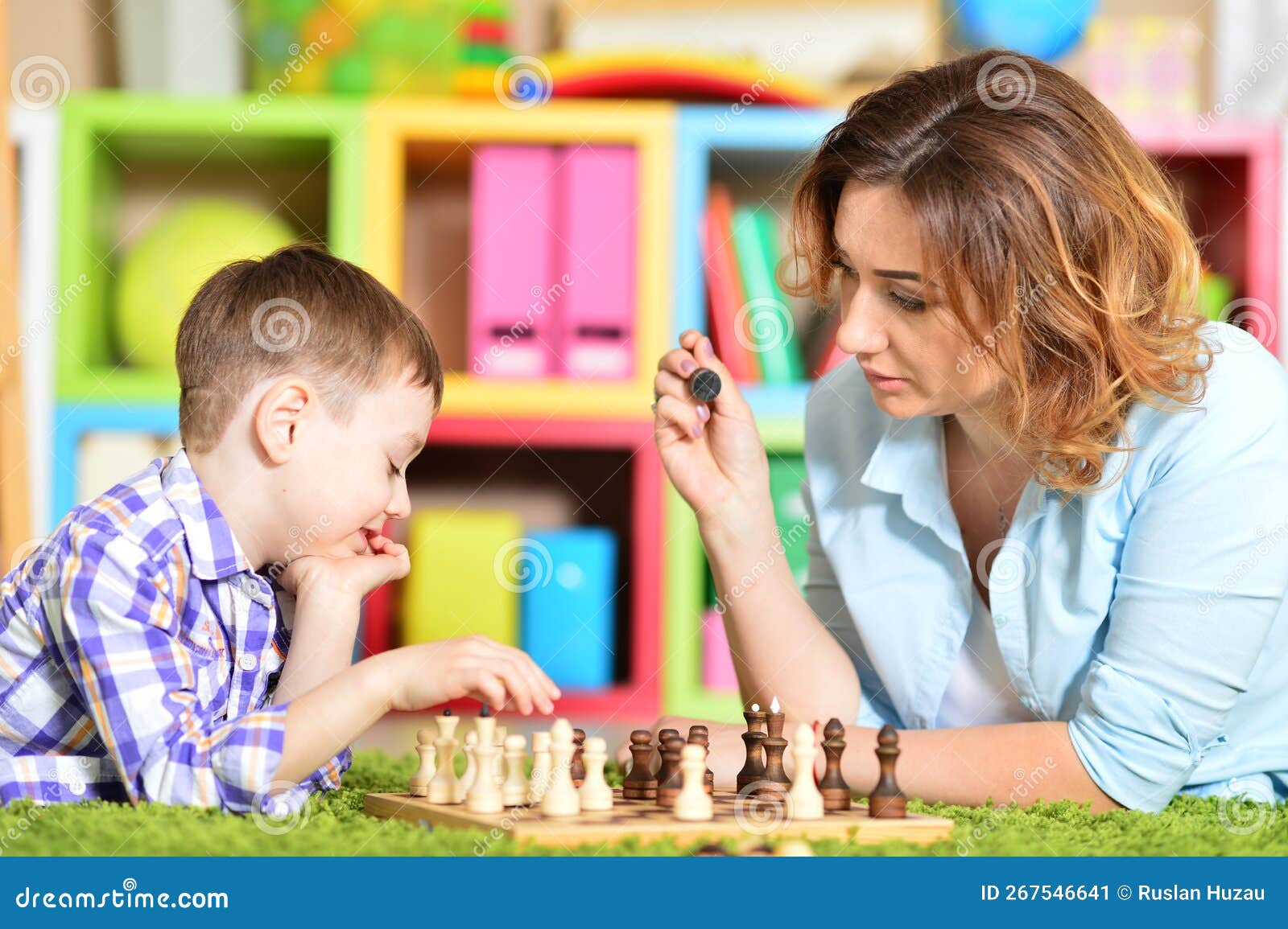 Mother with Son Playing Chess at Home Stock Image - Image of adult ...