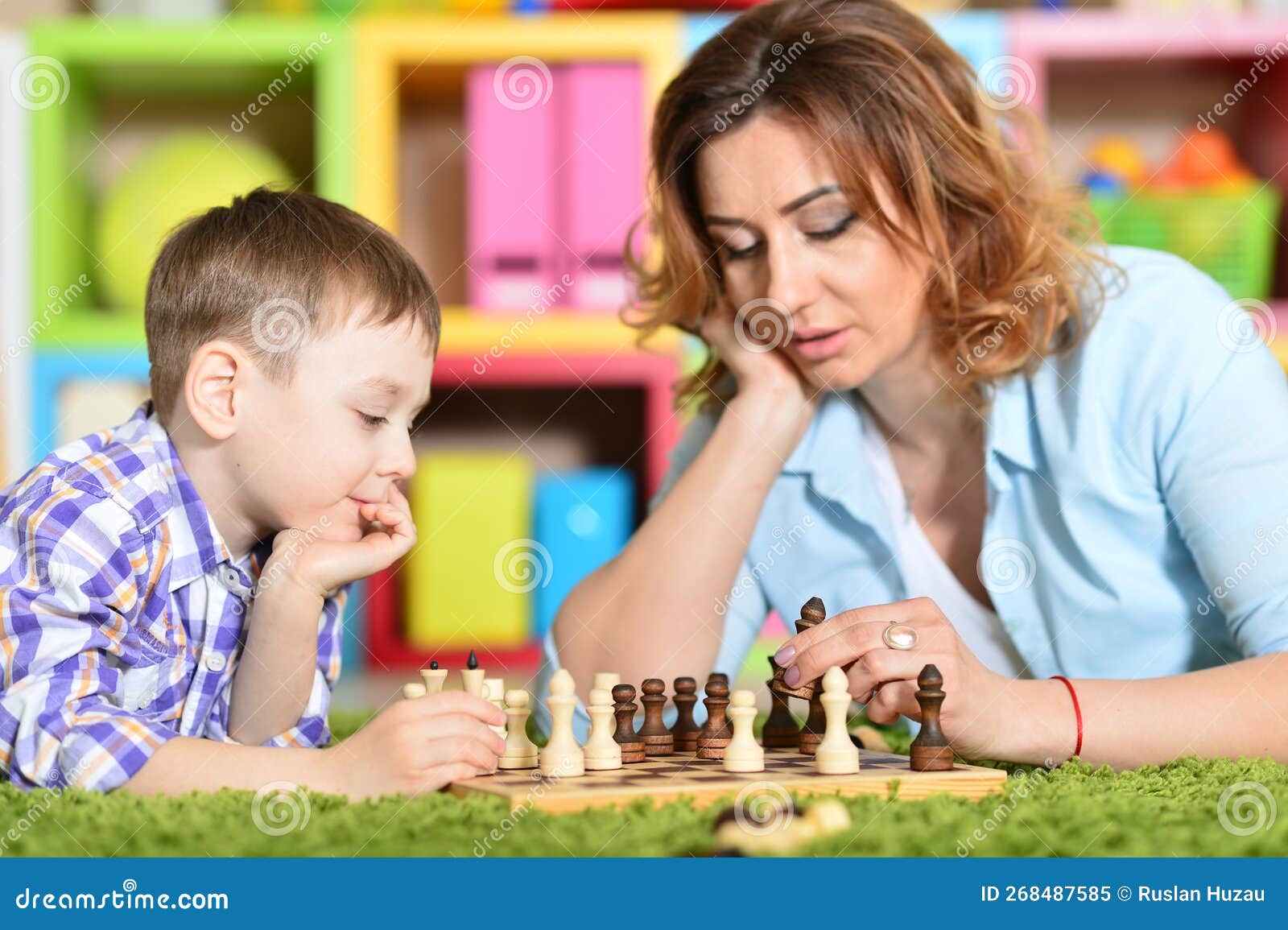 Mother with Son Playing Chess at Home Stock Image - Image of indoors ...