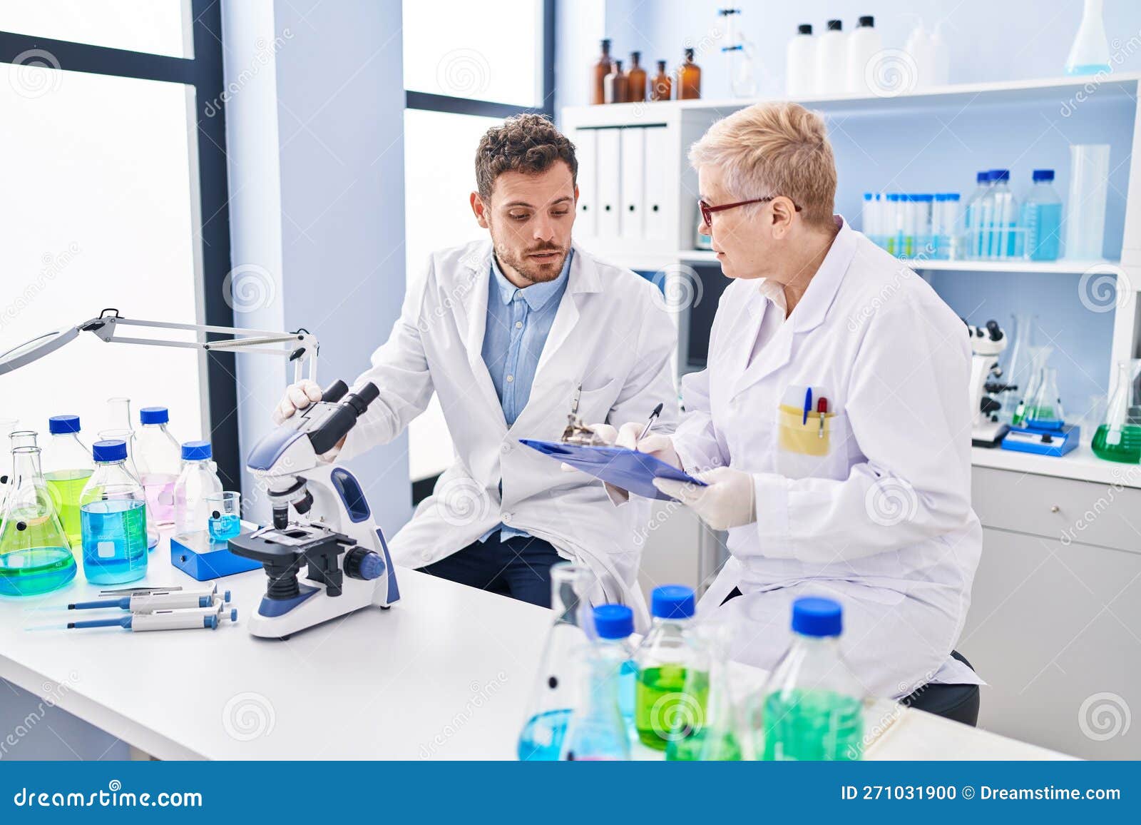 Mother and Son Scientist Partners Working at Laboratory Stock Photo ...