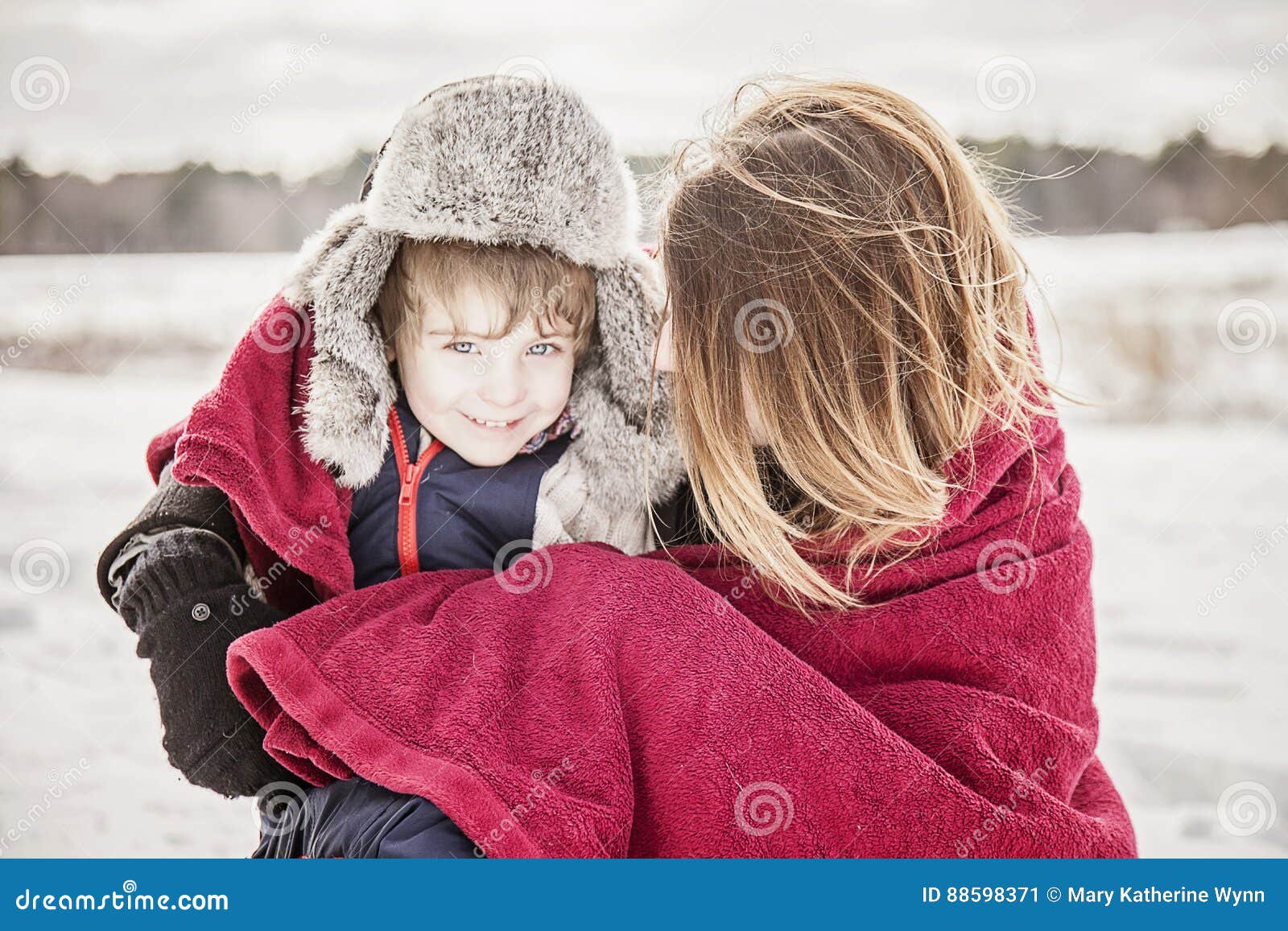Mother and Son Snuggling Under Blanket Stock Image - Image of outside ...