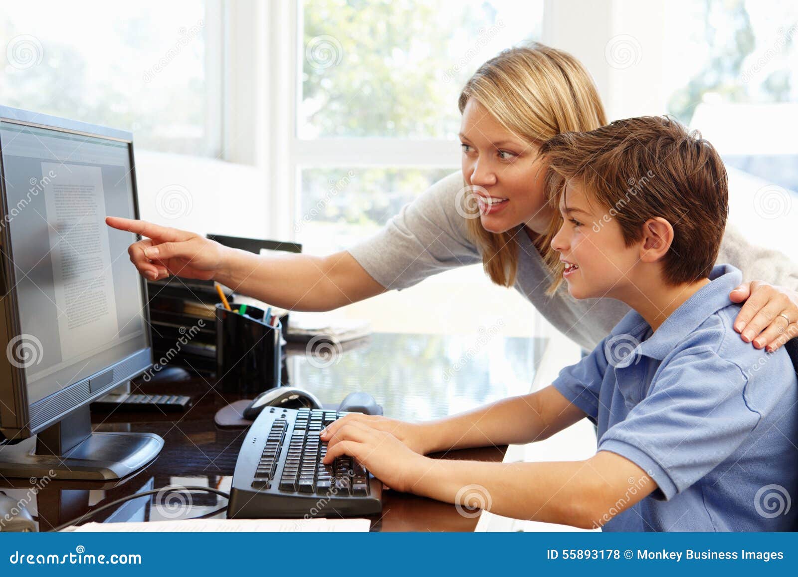 Mother and Son Using Computer at Home Stock Photo - Image of showing ...