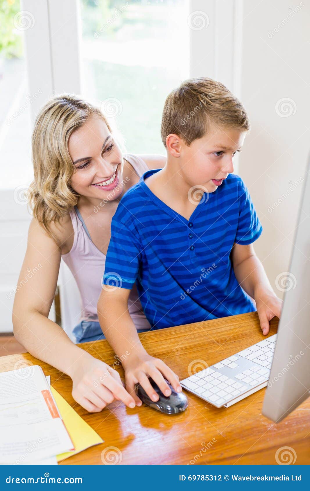 Mother and Son Using Computer in Living Room Stock Photo - Image of ...